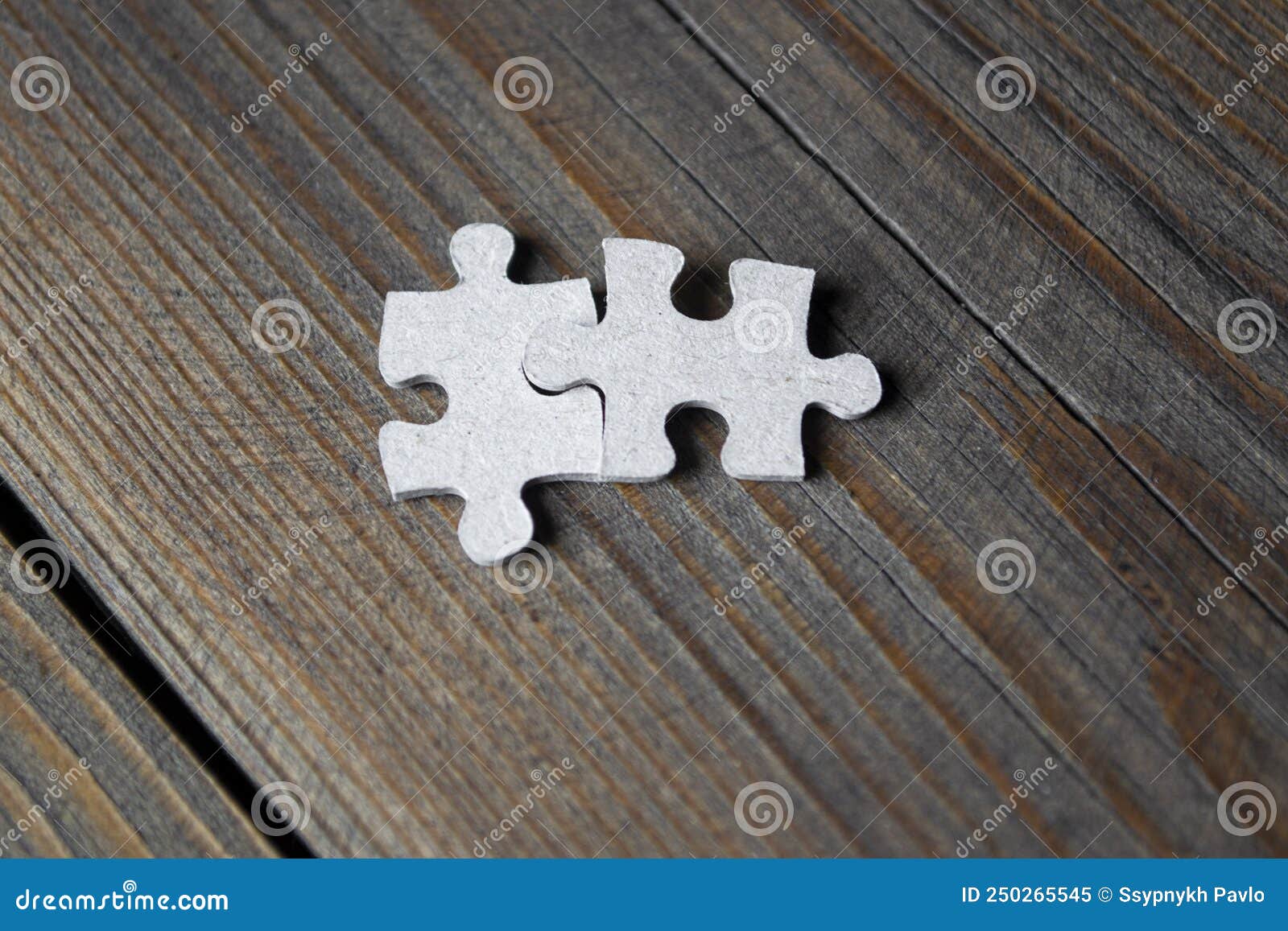 Two Puzzles on a Wooden Table. Puzzles Do Not Make a Difference. Two ...