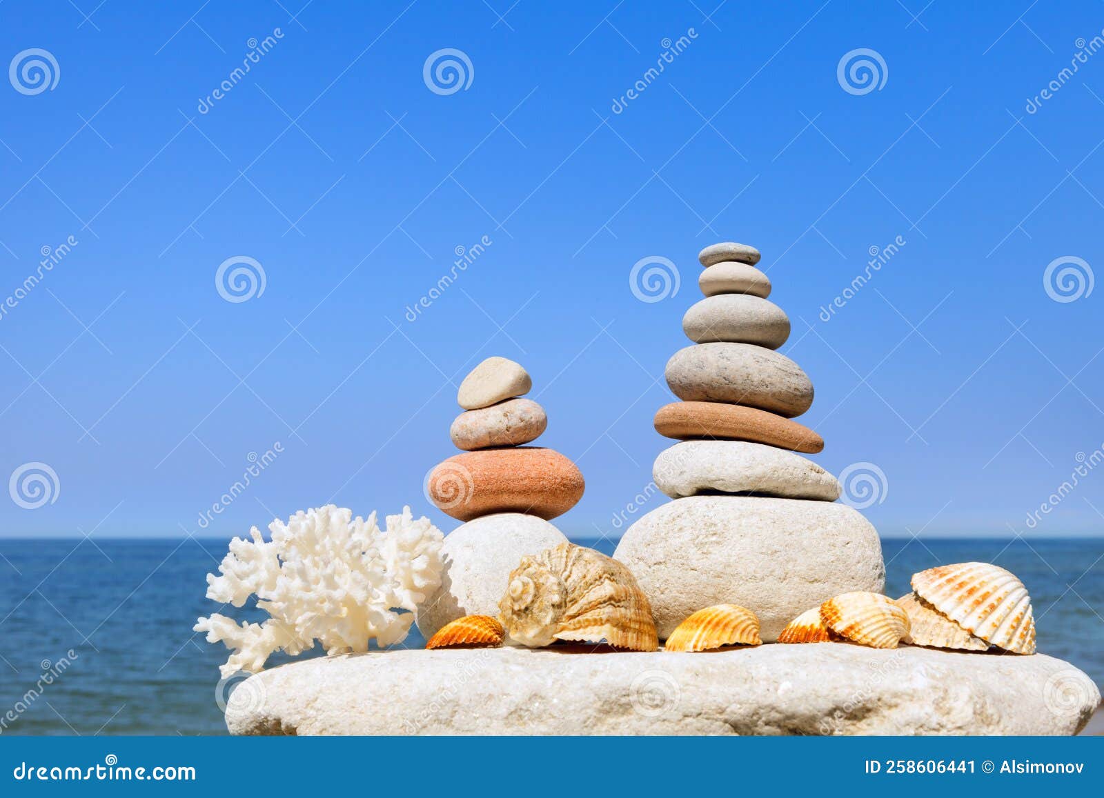 Two Pyramids of Multicolored Stones and Shells on the Background of the ...