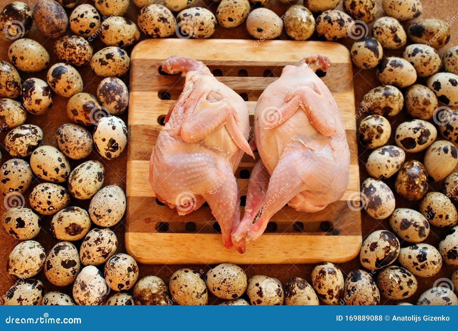 Two Quail Carcasses on the Board and Many Small Eggs Stock Photo ...