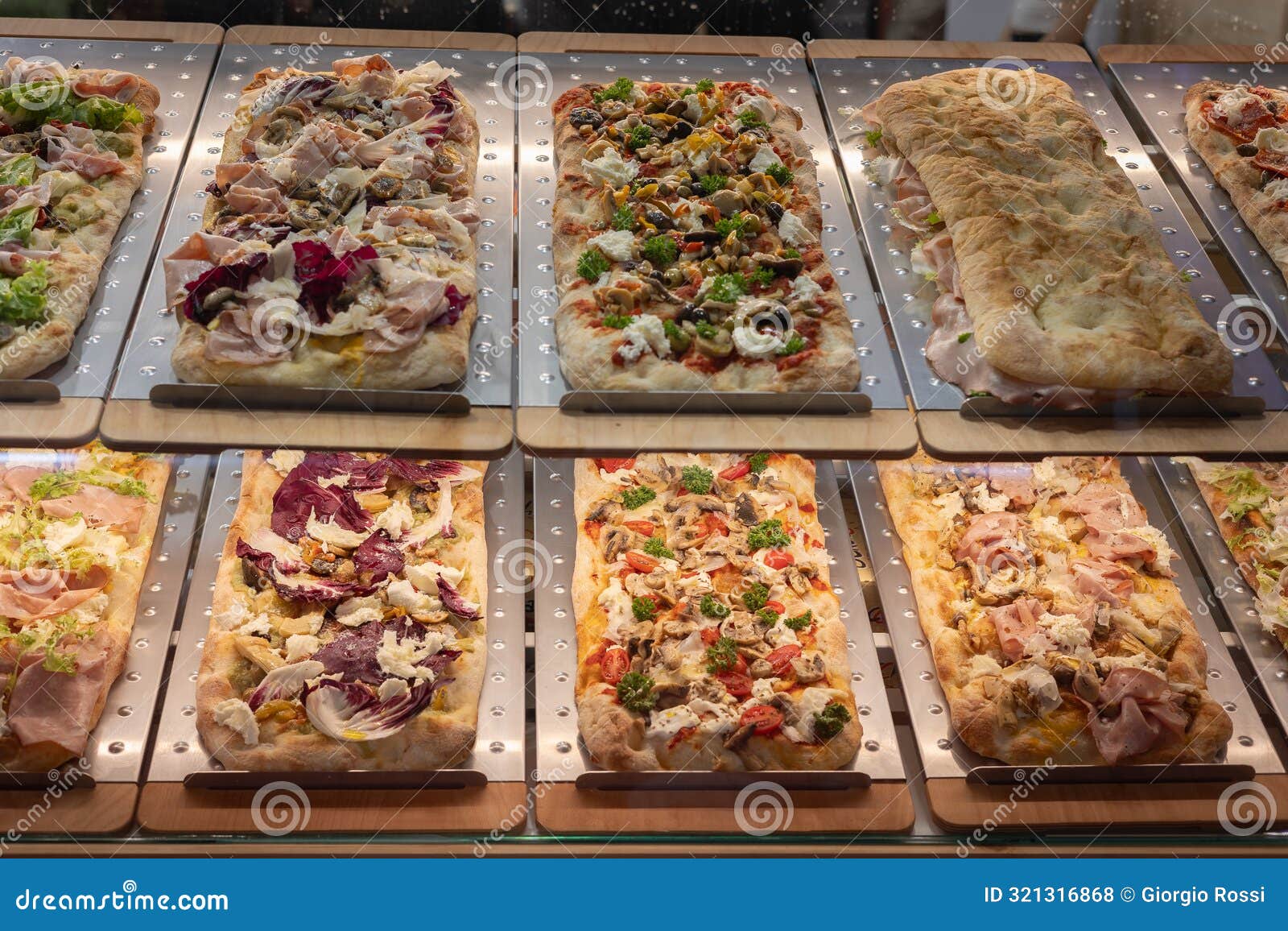 Two Racks of Freshly Baked Pizzas with Various Toppings Stock Photo ...