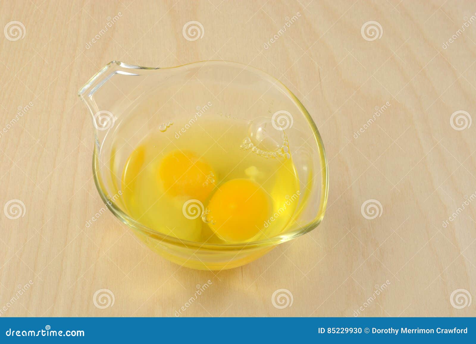 Two Raw Eggs in Measuring Cup Stock Photo - Image of cracked, uncooked ...