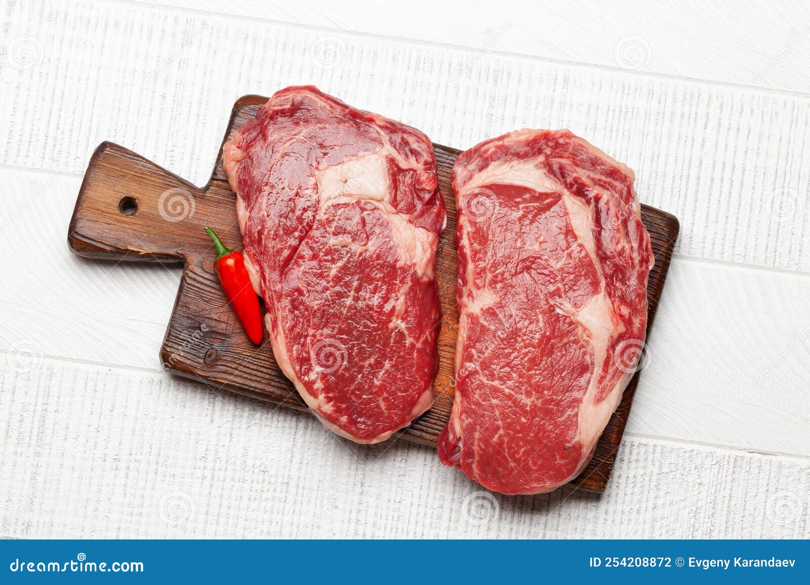 Two raw ribeye beef steaks stock photo. Image of marbled - 254208872