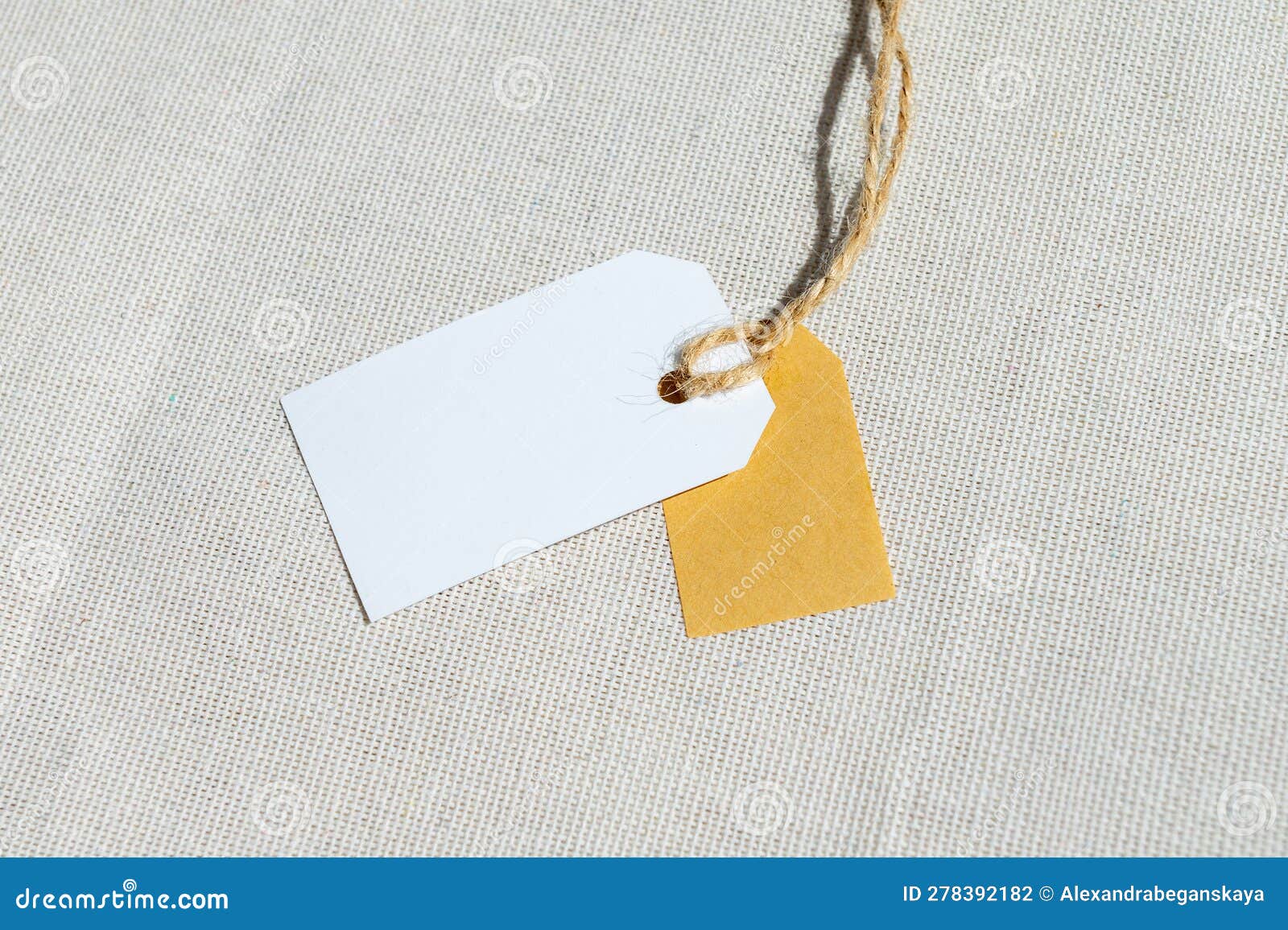 Two Rectangular Tags with a Rope on a Gray Fabric. Empty Label Mockup ...