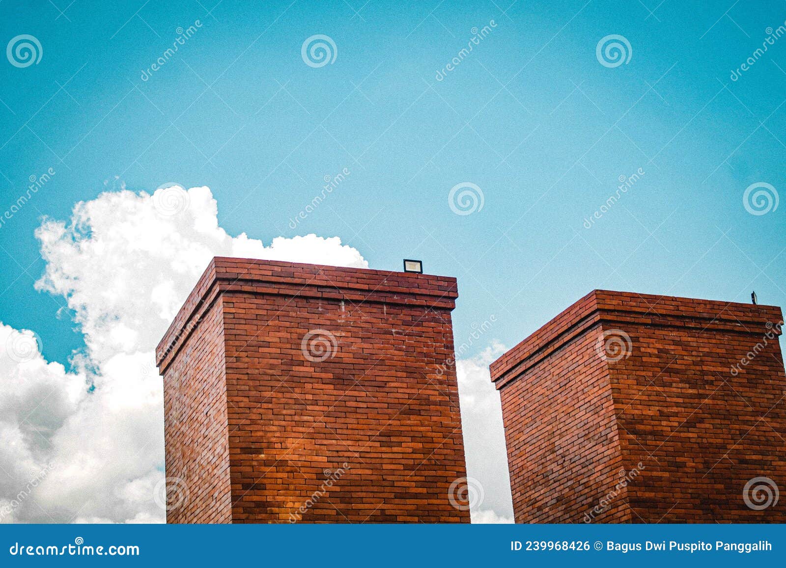 Two red brick towers stock photo. Image of building - 239968426