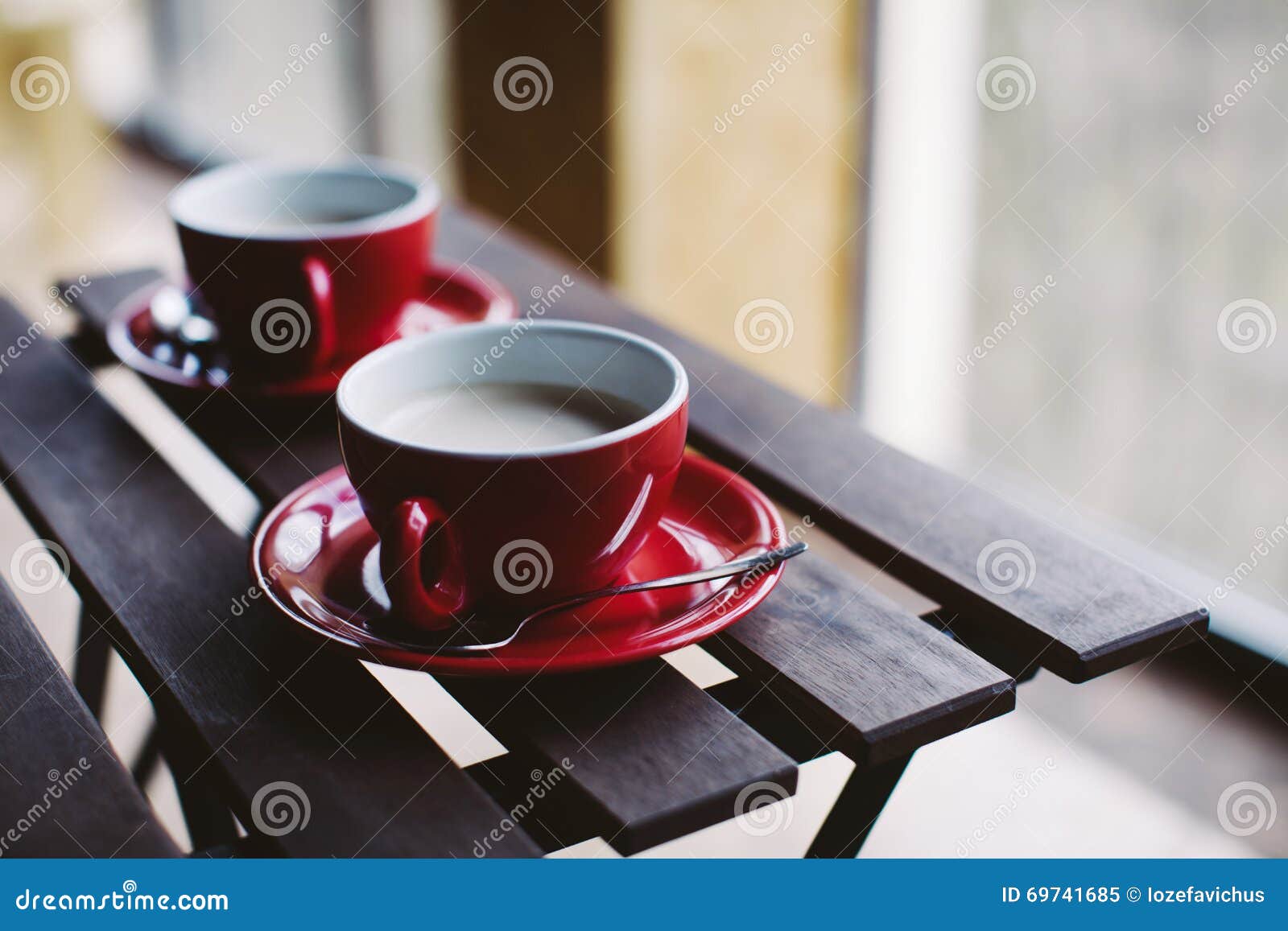 Two red cups on table stock image. Image of green, heat - 69741685