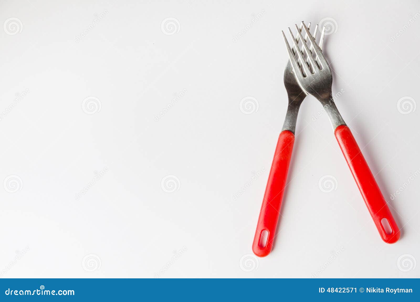 Two red forks together stock image. Image of closeness - 48422571