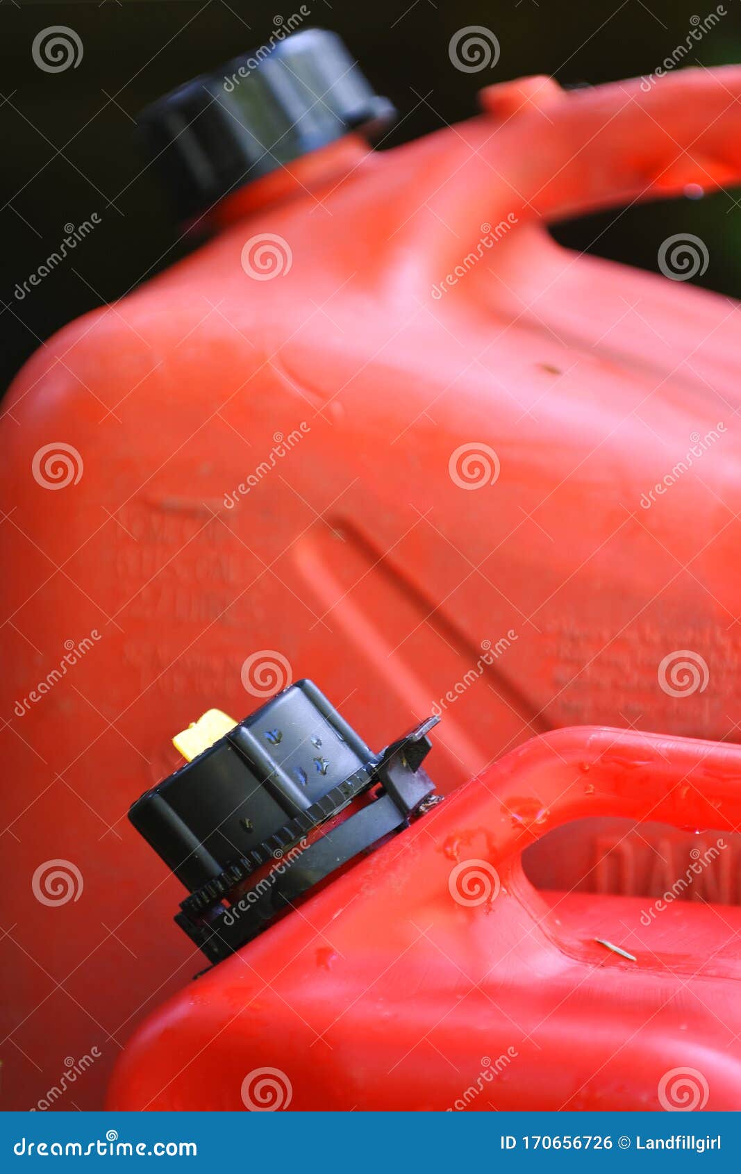 Two Red Gas Cans stock photo. Image of closeup, jerrycan - 170656726