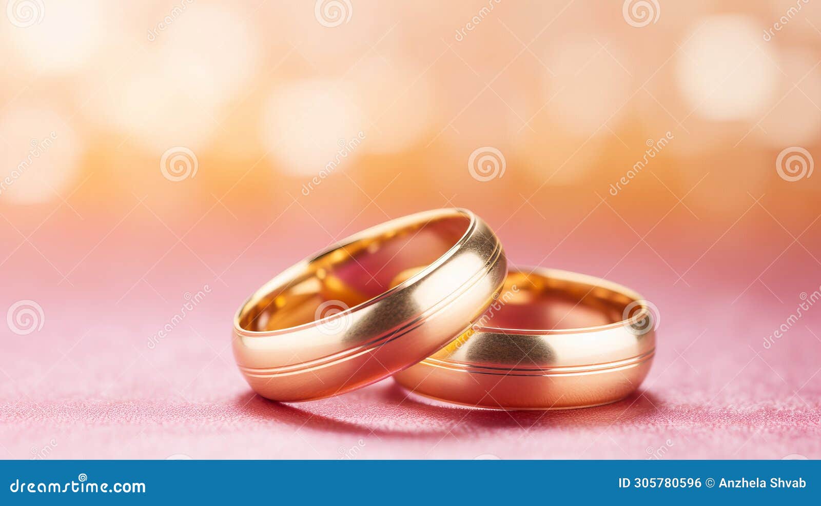 Two Red Gold Wedding Rings on Soft Pink Bokeh Background with Copy ...