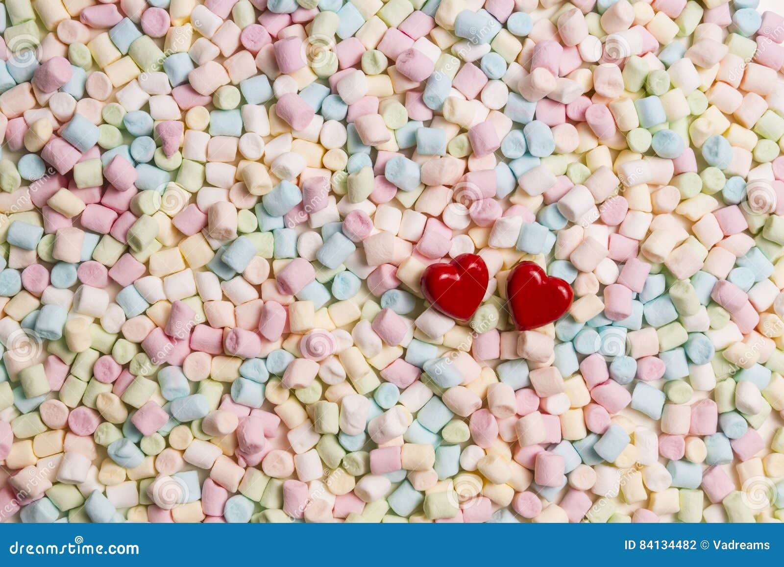 Two Red Hearts on Colorful Mini Marshmallows Background Stock Photo ...