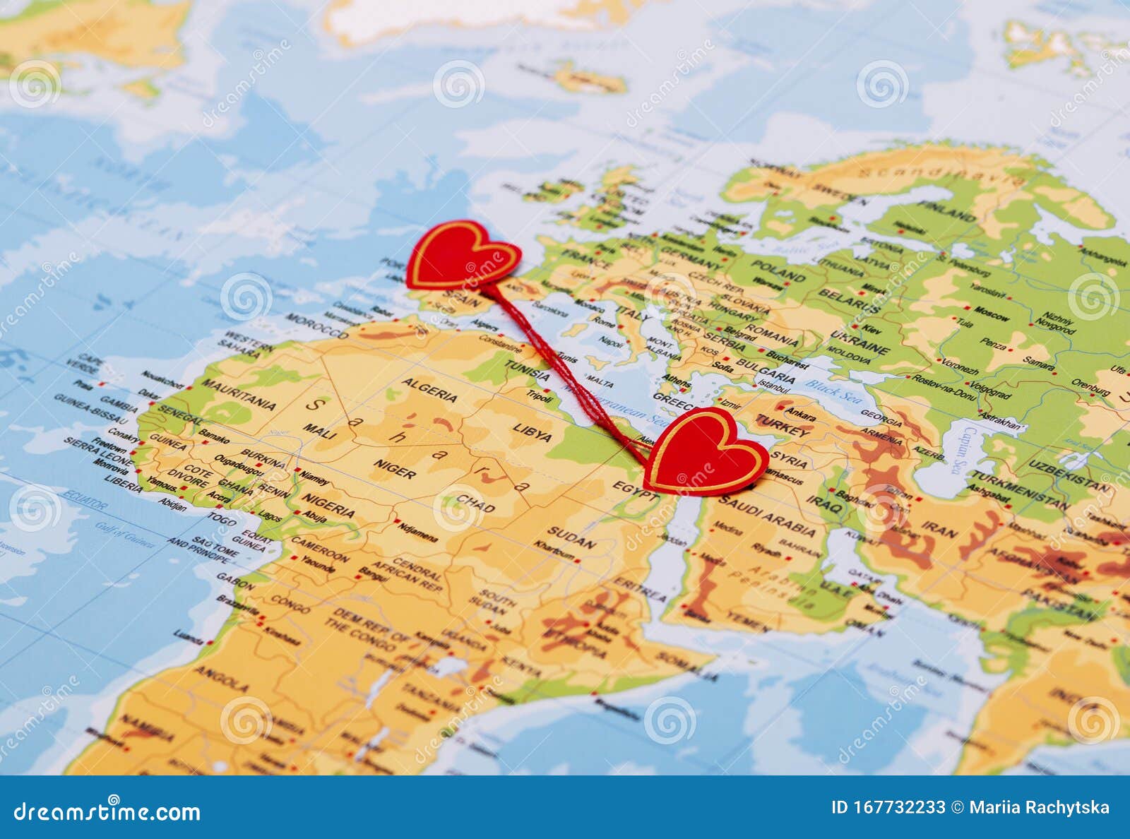 Two Red Hearts on a World Map Connected by a Red Thread Stock Image ...