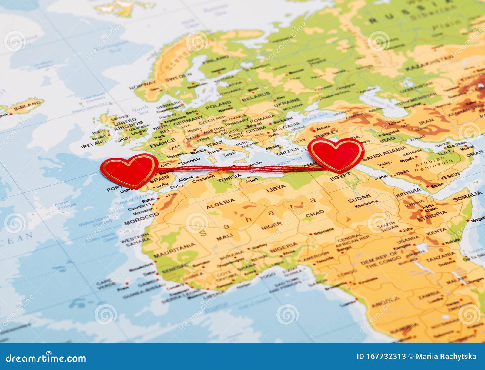 Two Red Hearts on a World Map Connected by a Red Thread Stock Image ...