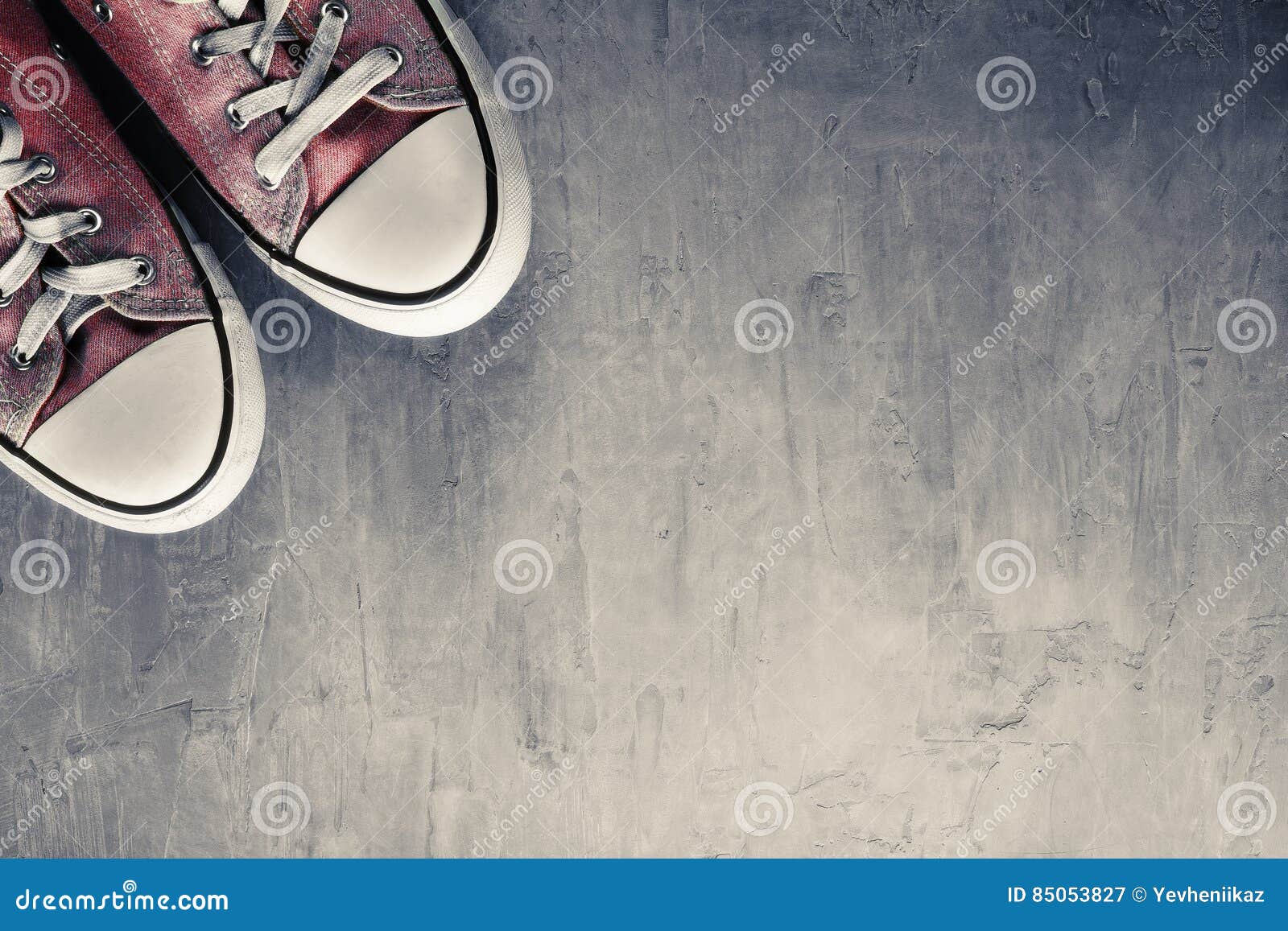 Two Red Sneaker on a Clean Concrete Background Stock Image - Image of ...