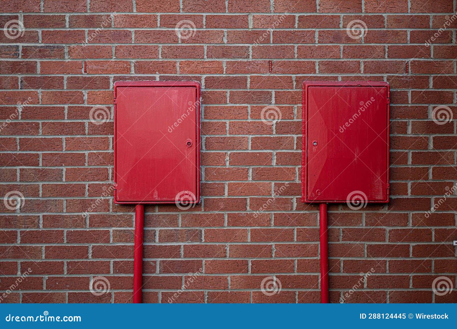 Two Red Square Boxes Affixed To a Brick Wall Stock Image - Image of ...