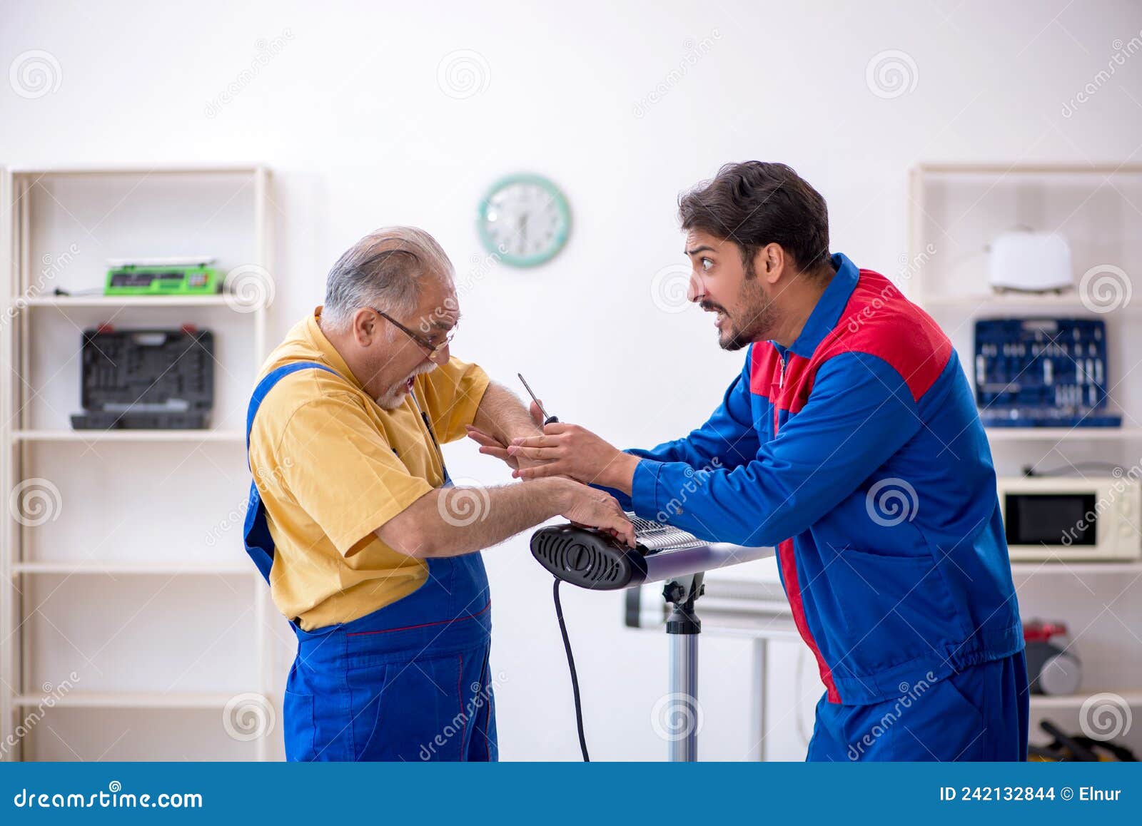 Two Male Repairmen Working at Workshop Stock Photo - Image of heater ...