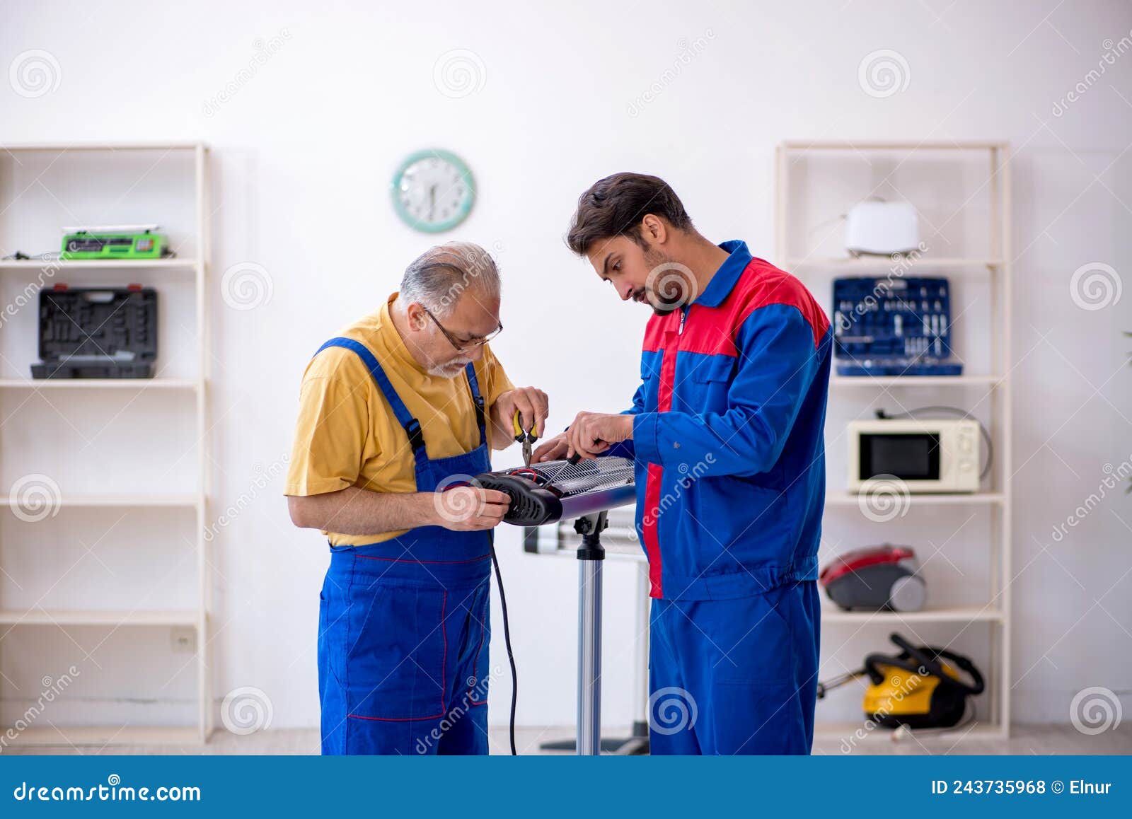 Two Male Repairmen Working at Workshop Stock Photo - Image of repairmen ...