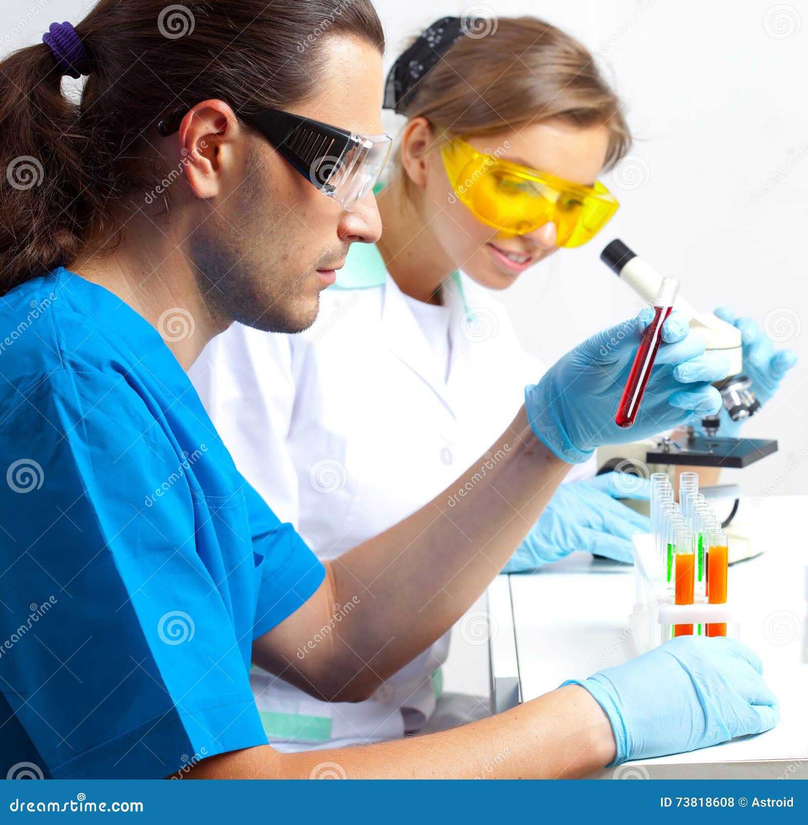 Two researchers in the lab stock photo. Image of people - 73818608