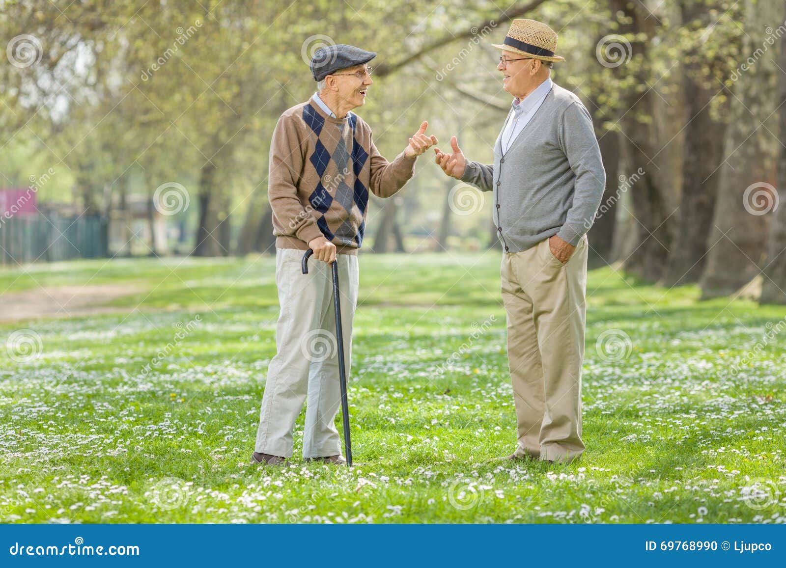 Two Retired Seniors Talking in Park Stock Photo - Image of people ...