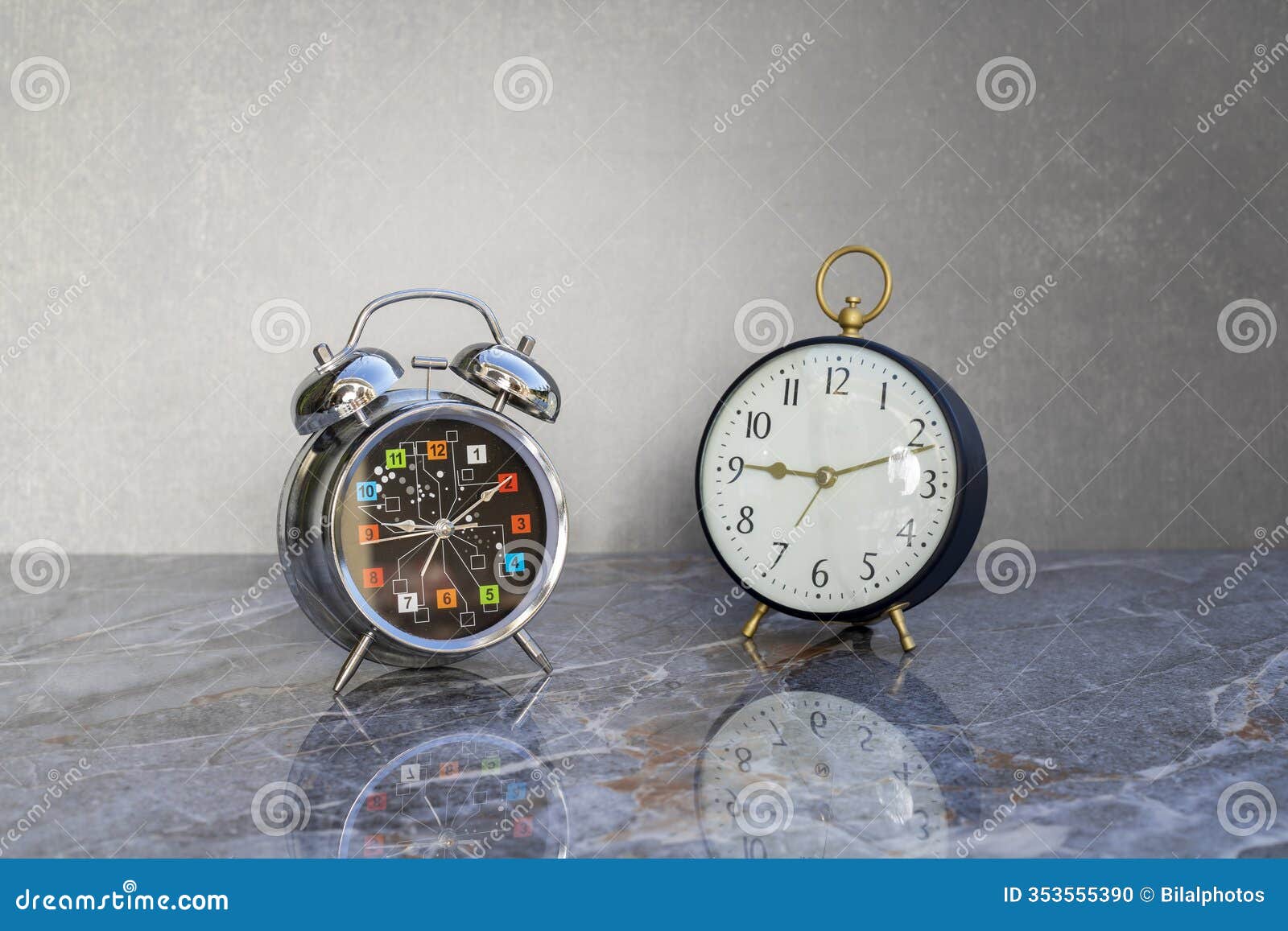 Two Retro Table Clocks with Reflection on Polished Marble Surface Stock ...