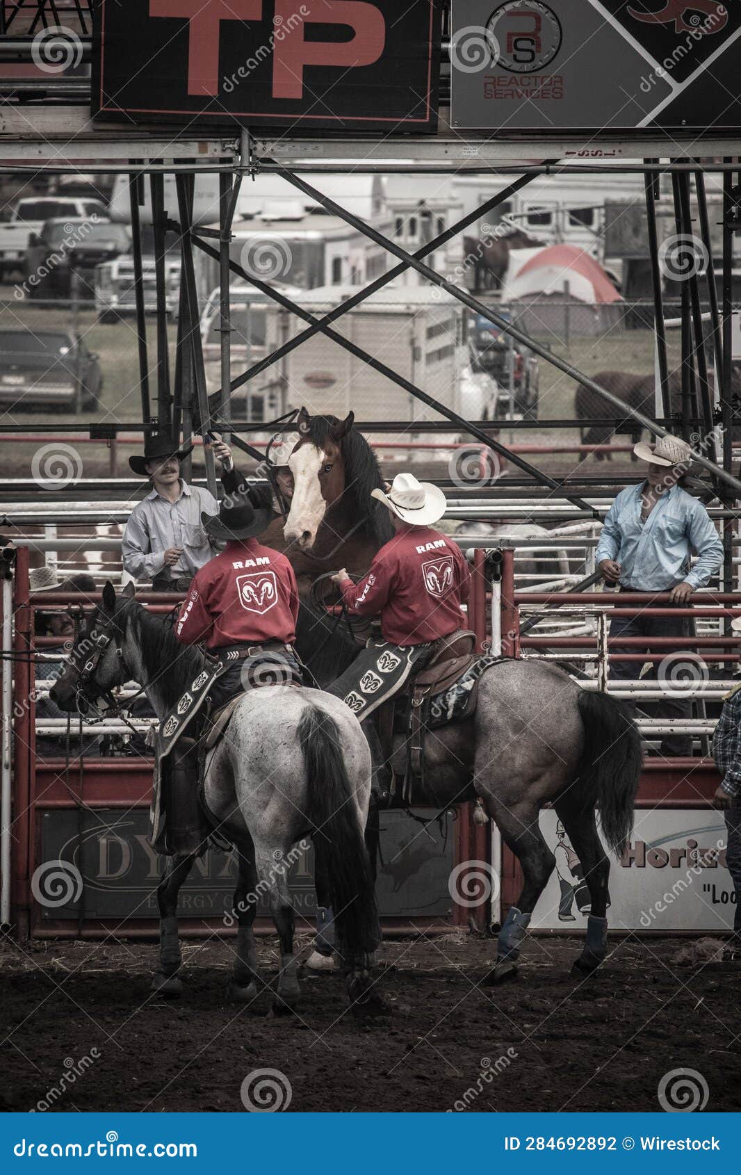 Two Riders in an Equestrian Arena during the Rodeo Show. Editorial ...