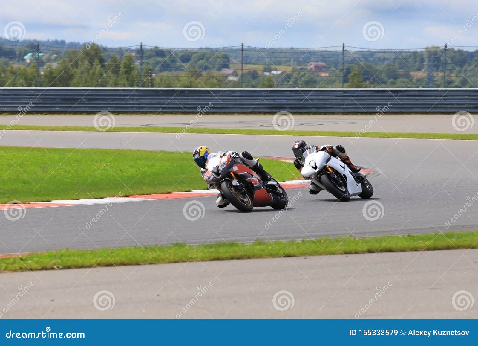 Two Riders on Motorcycles Riding on the Race Track Stock Image - Image ...