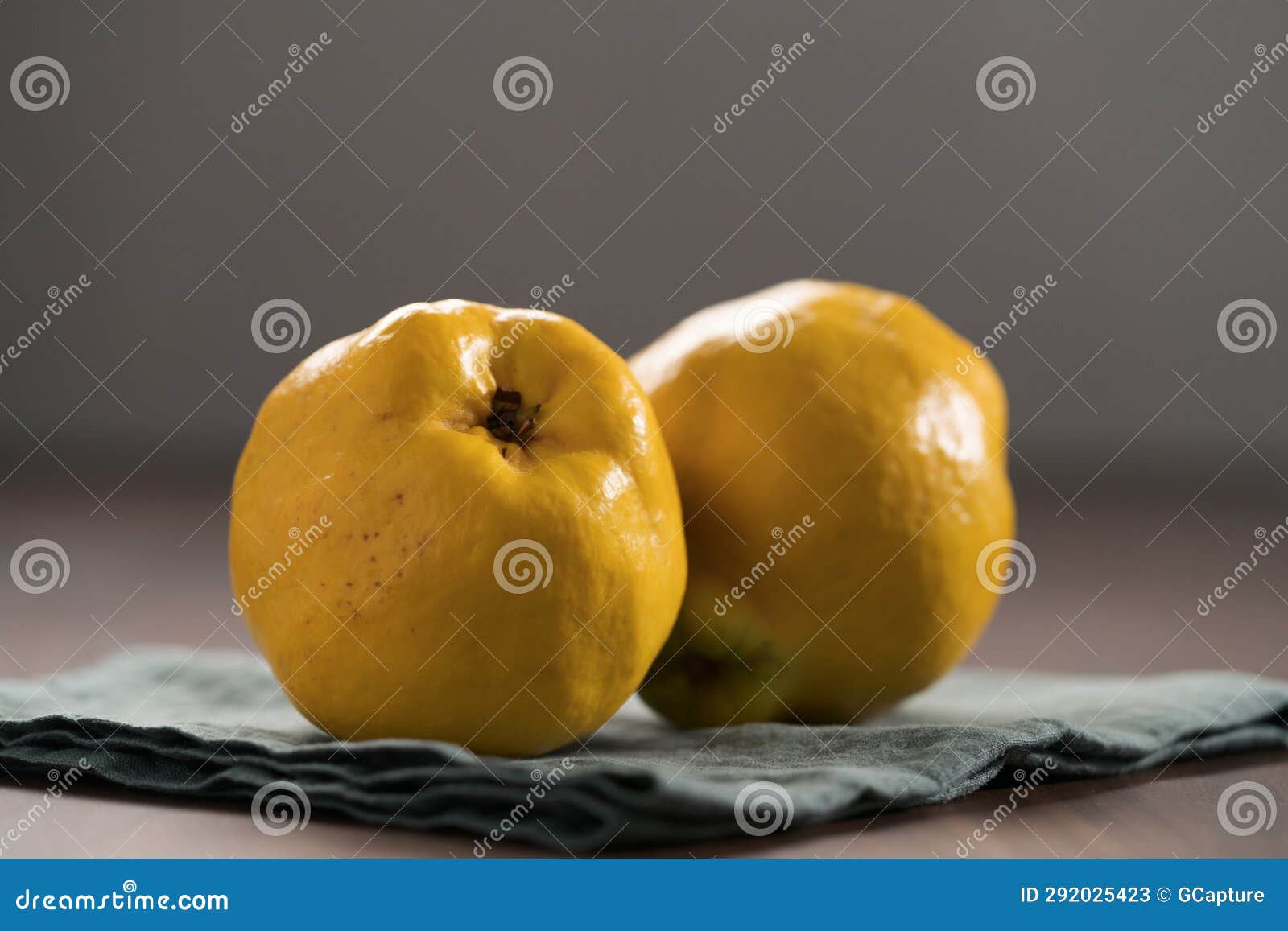 Two Ripe Quince Fruit on Wood Table Stock Image - Image of wood ...