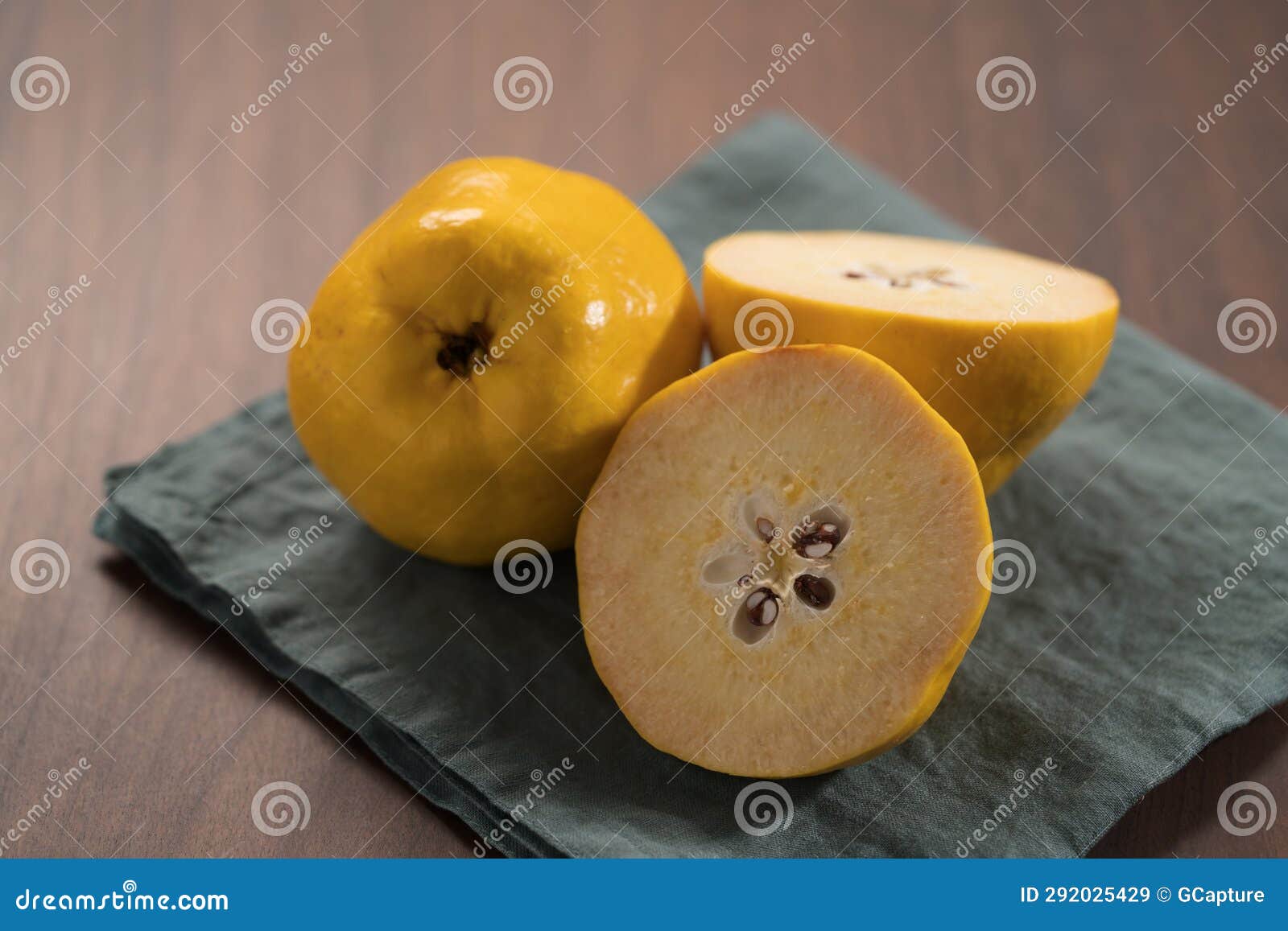 Two Ripe Quince Fruit on Wood Table Stock Image - Image of leaf, group ...