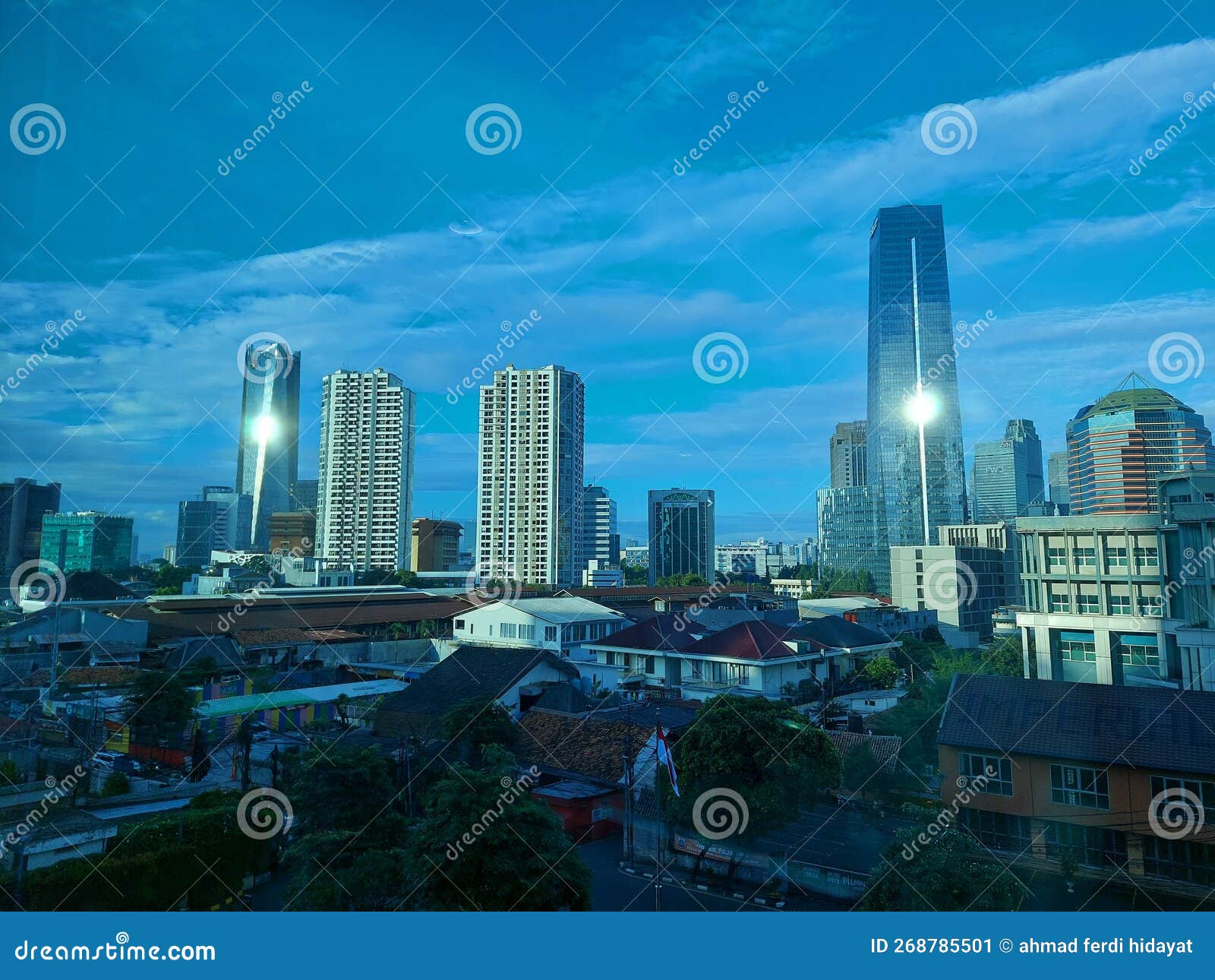 The Two Rising Sun Infront of the Building Tower in Jakarta Editorial ...