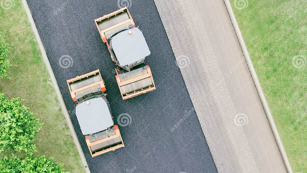 Two Road Rollers Roll the Road Surface on One of the Highway Lanes ...