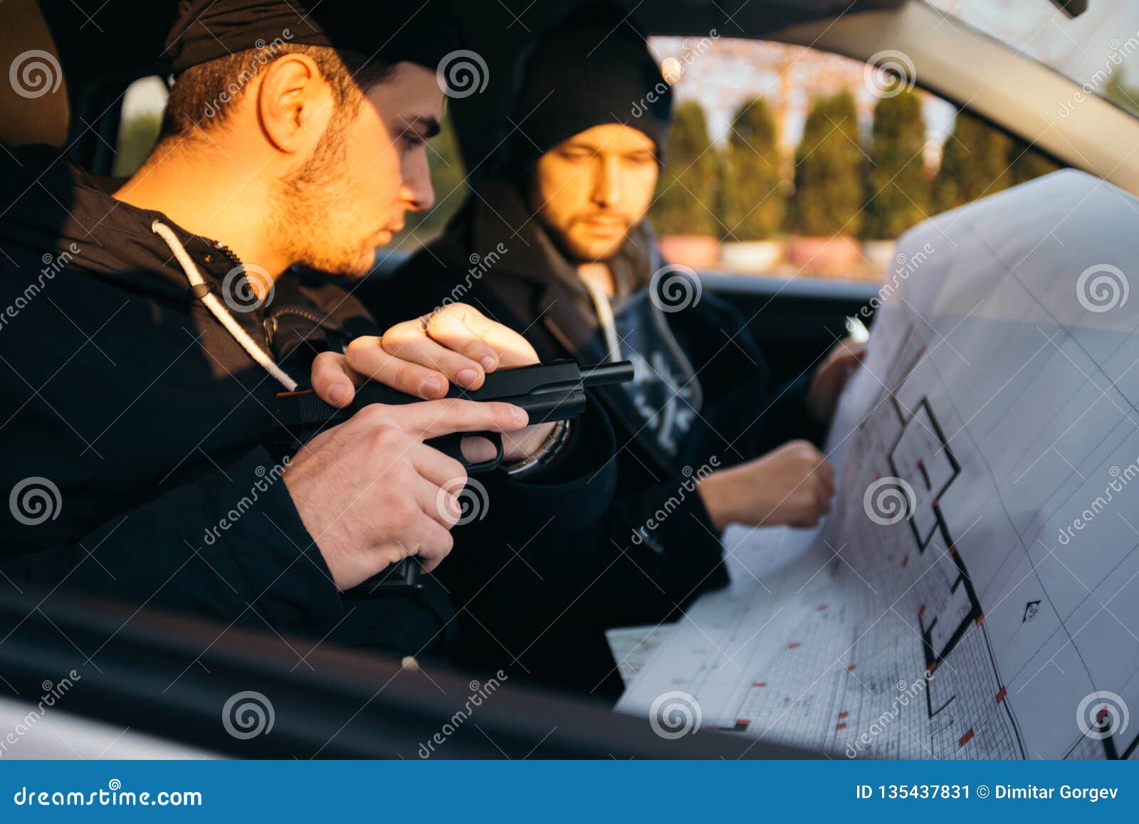Two Robbers Planning and Pointing on the Blueprint Map Their Objective ...