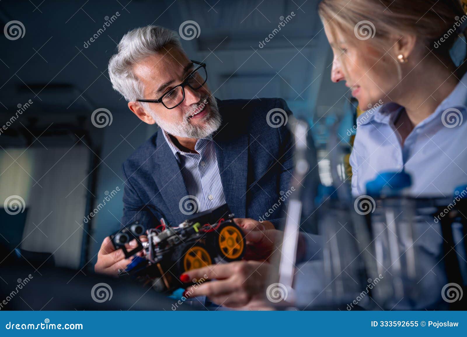 Two Robotics Engineers Working on New Project, Standing in Laboratory ...