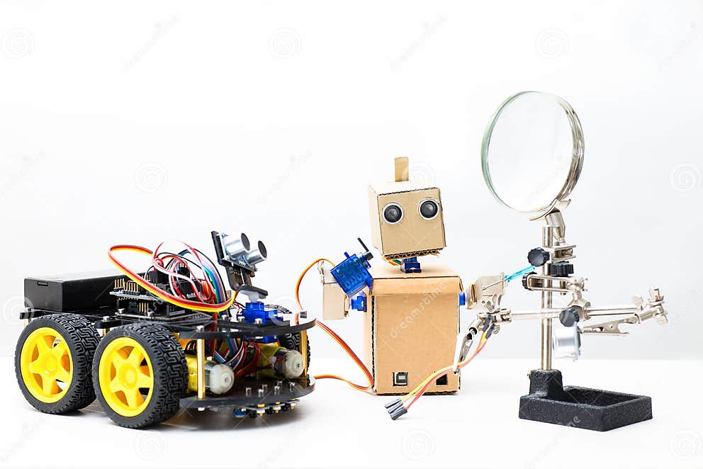 Two Robots Stand on a Table on a White Background Stock Image - Image ...