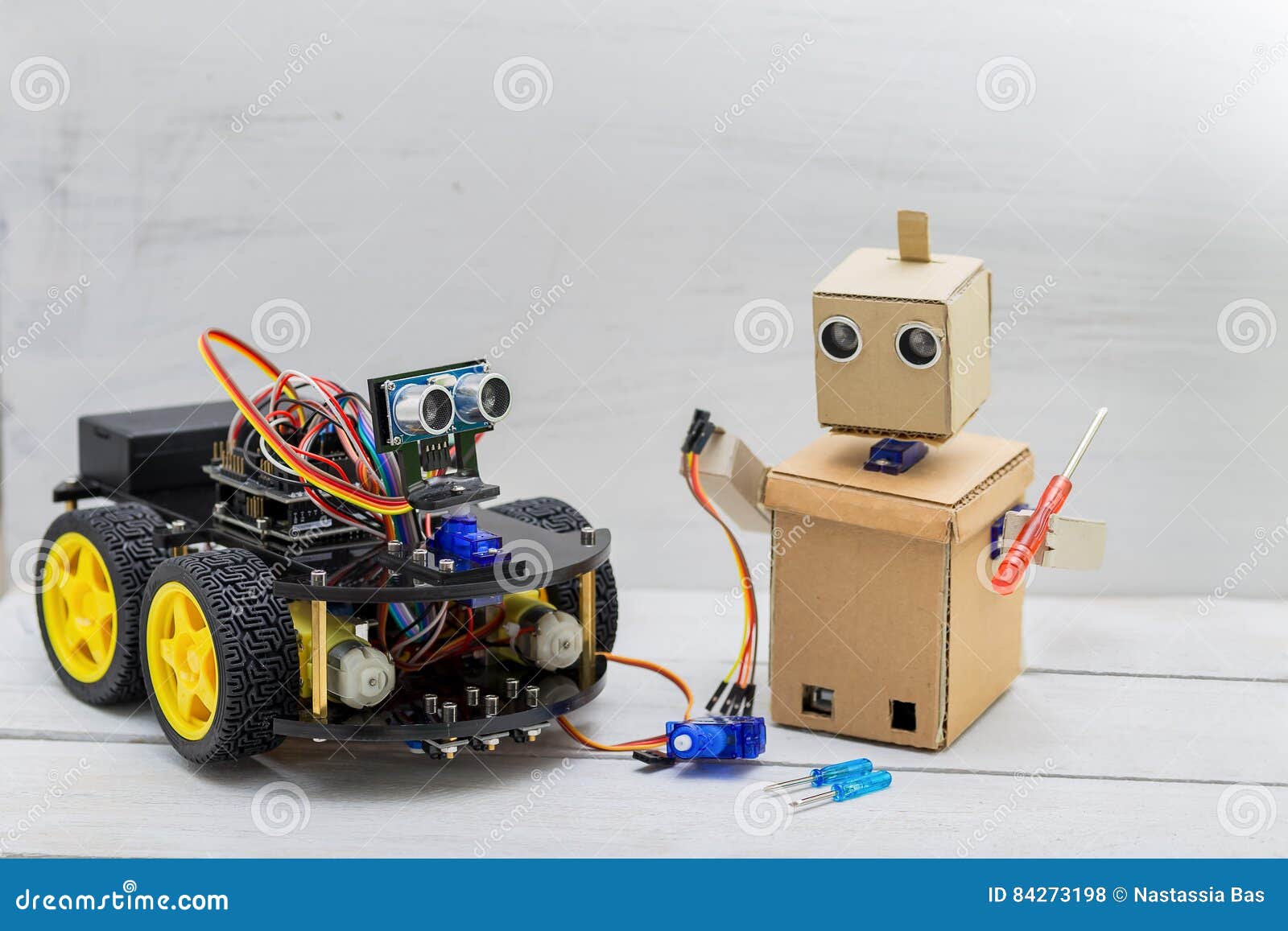 Two Robots are on the Table, the Robot Screwdriver and Wire Stock Photo ...