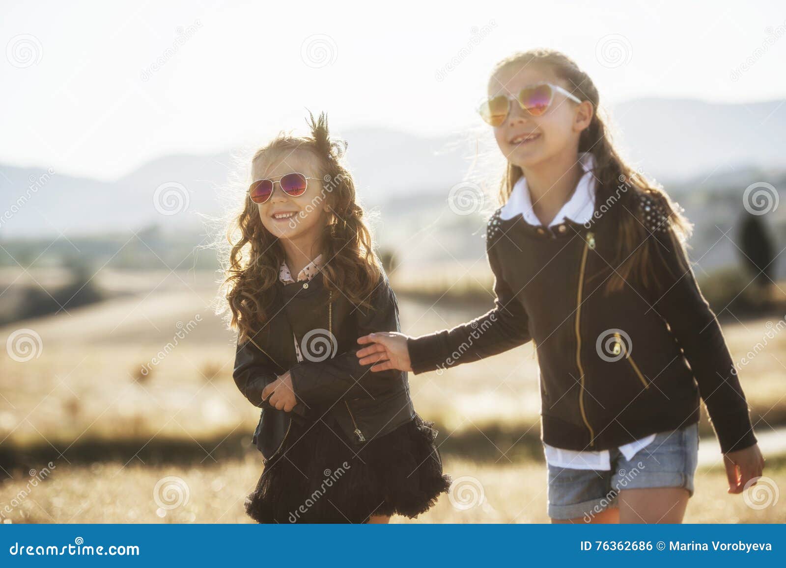 Two Rock Girls in a Sunset Light Stock Photo - Image of hair, outside ...
