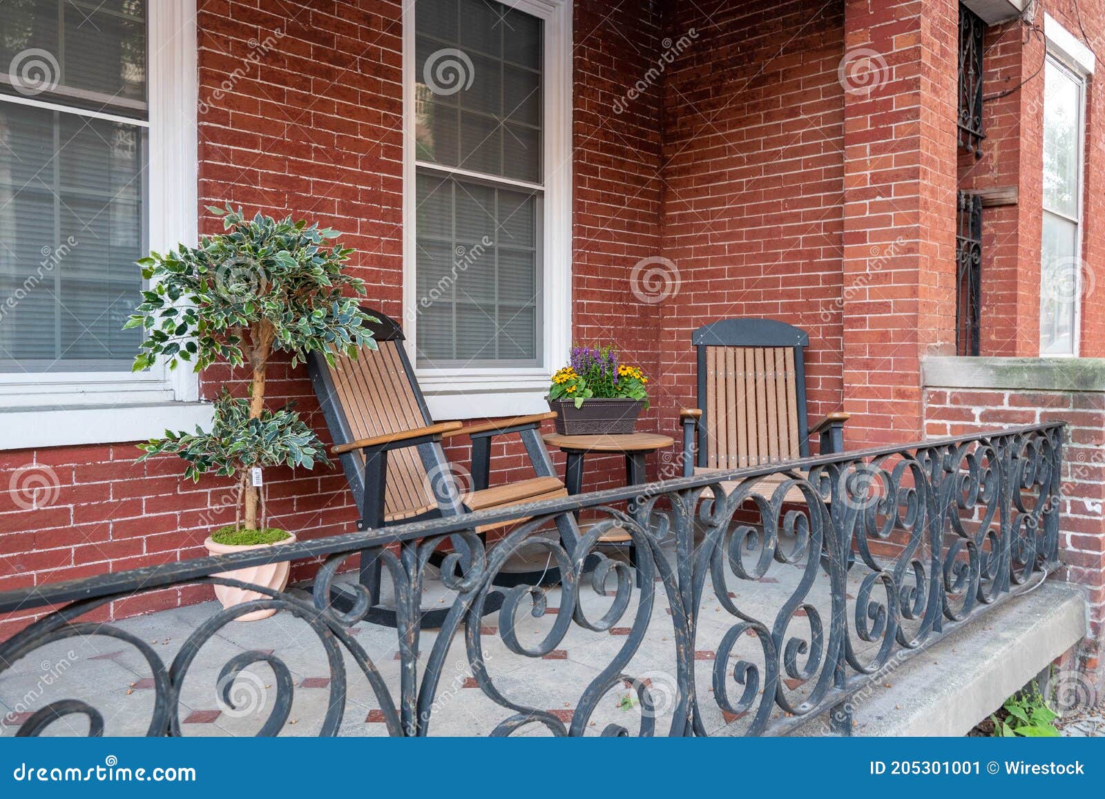 Two Rocking Chairs on a Porch with an Iron Railing Stock Image - Image ...