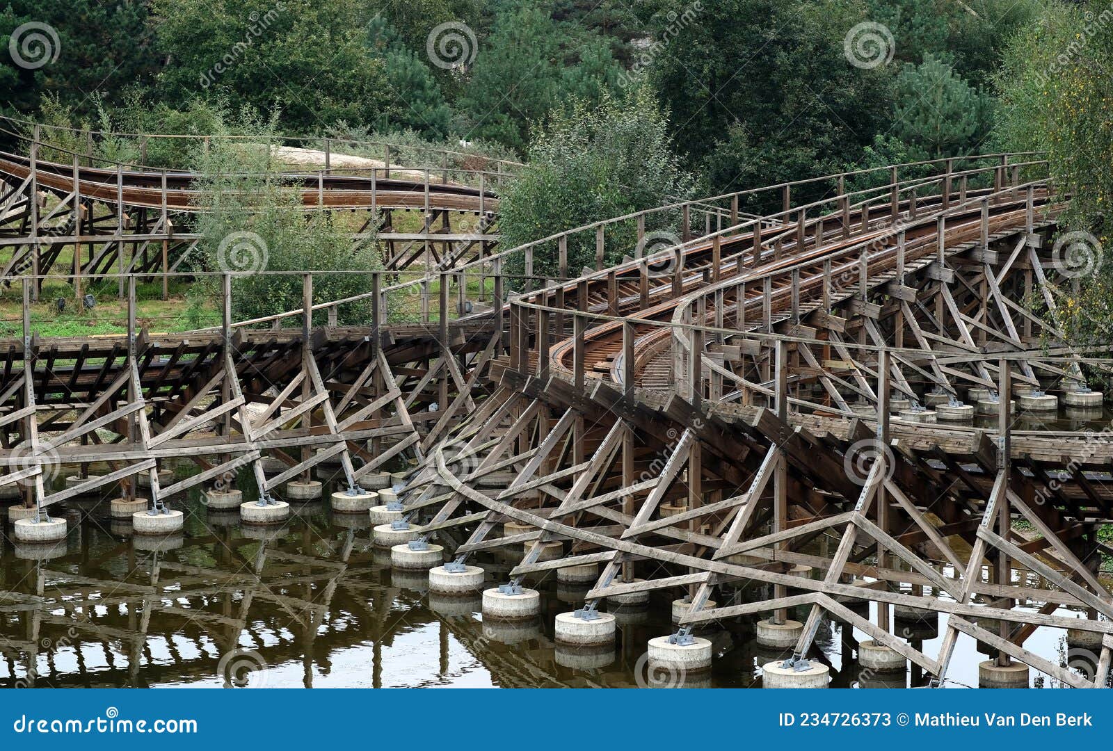 Two Rollercoasters Next To a Lake in a Themepark Stock Image - Image of ...