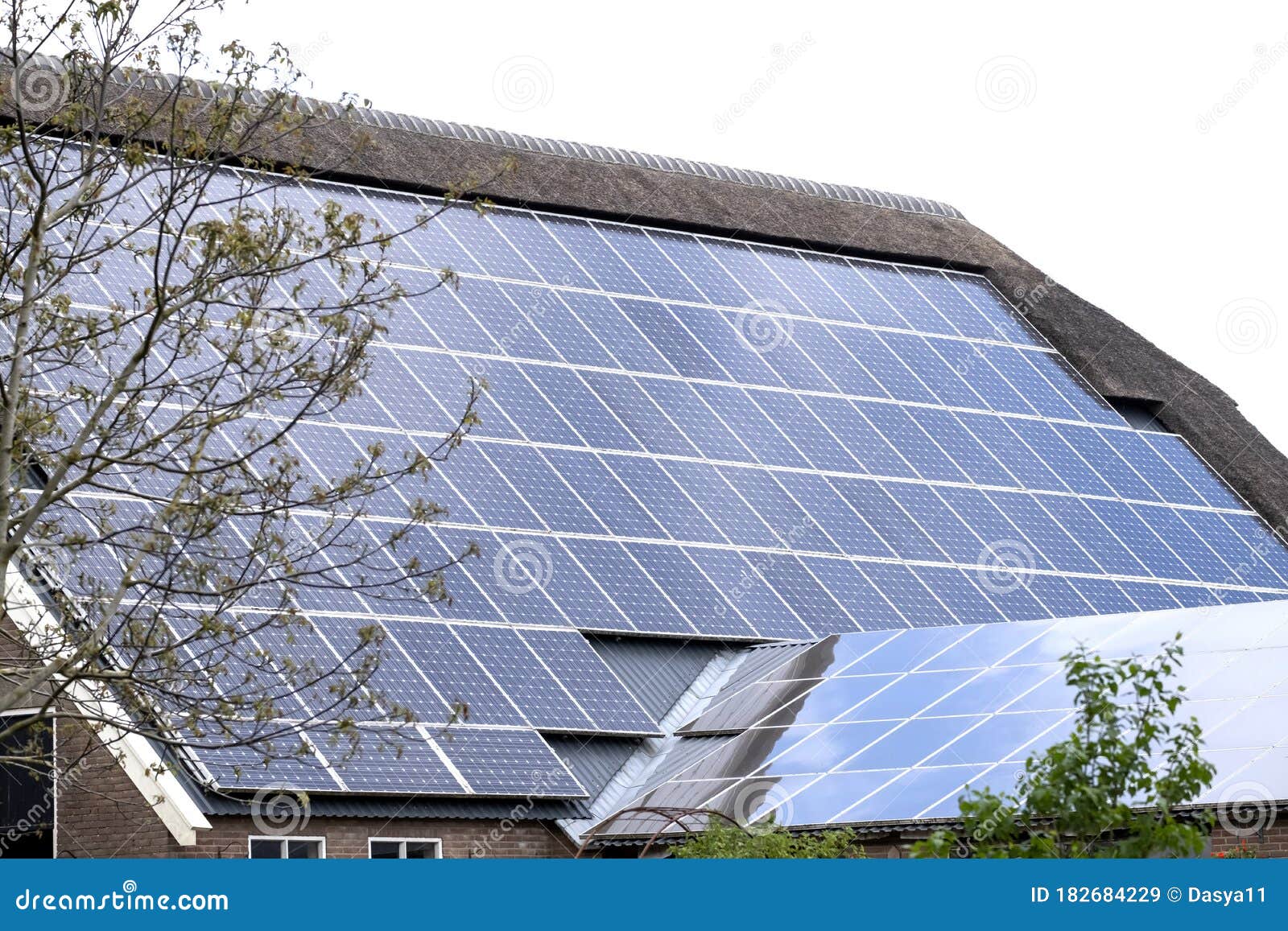 Two Roofs with Solar Panel Reflecting the Clouds En Trees. in the ...