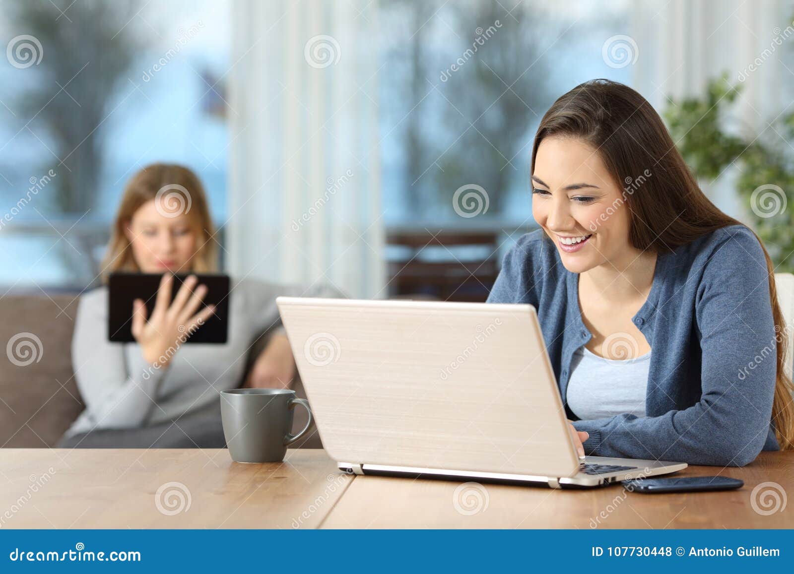 Roommates Using Multiple Wifi Devices at Home Stock Photo - Image of ...