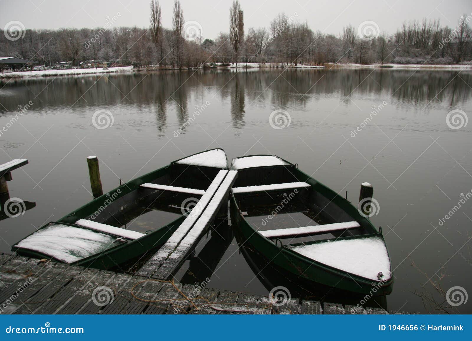 Two Rowing Boats Covered with Snow in Winter Lake Stock Photo - Image ...