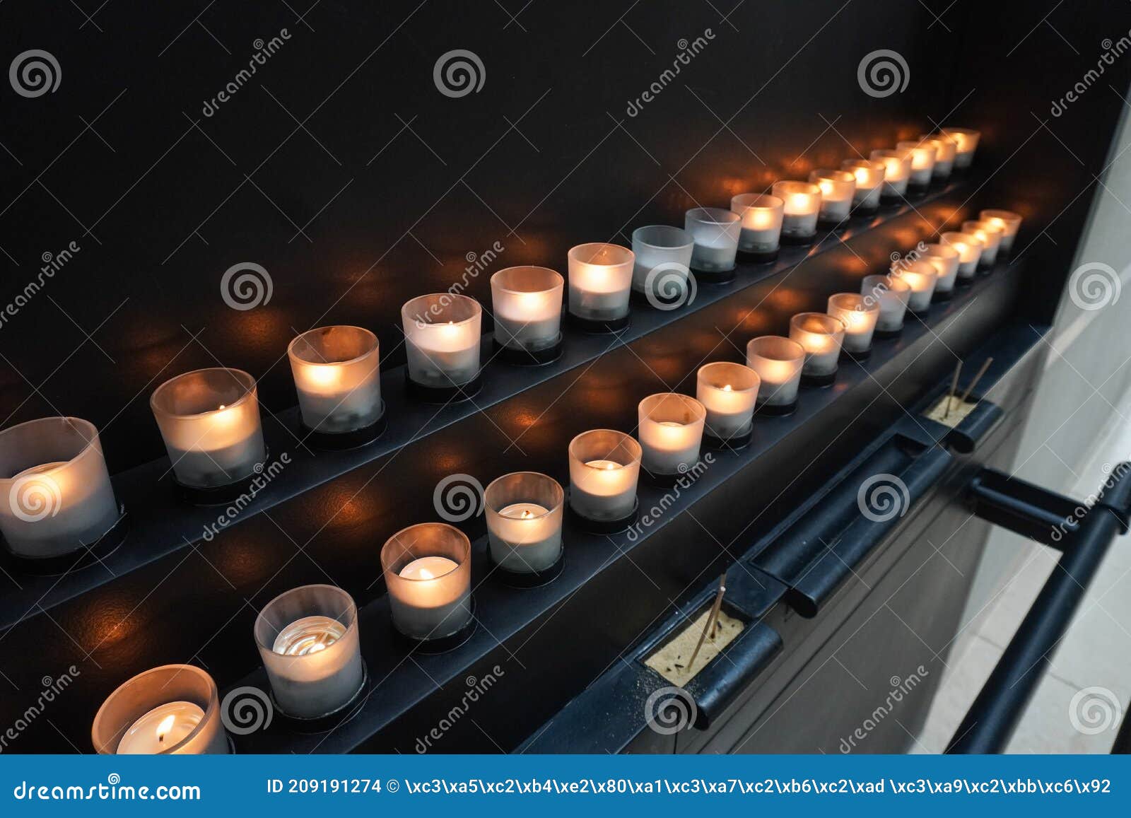 Two rows of small candles stock photo. Image of burning - 209191274