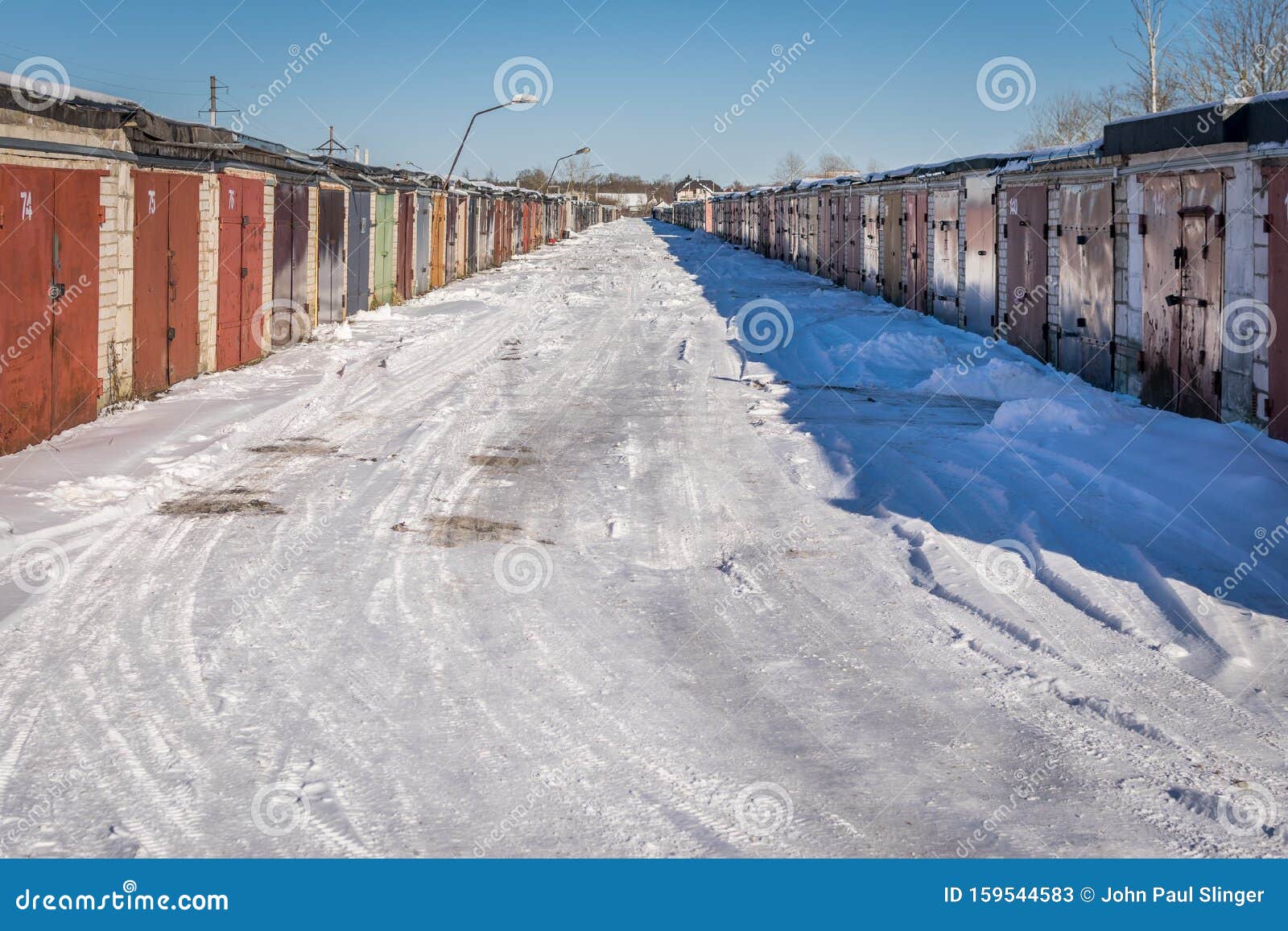 Two Rows of Soviet Built Garages or Storage Units with Snow on the ...