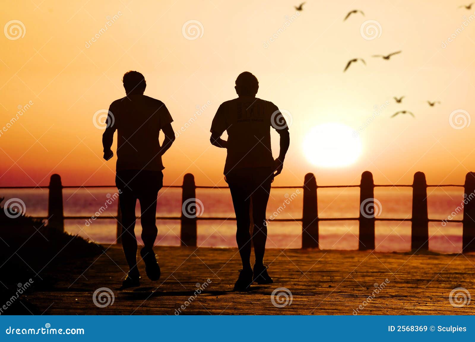 Two runner stock image. Image of sunset, beach, runner - 2568369