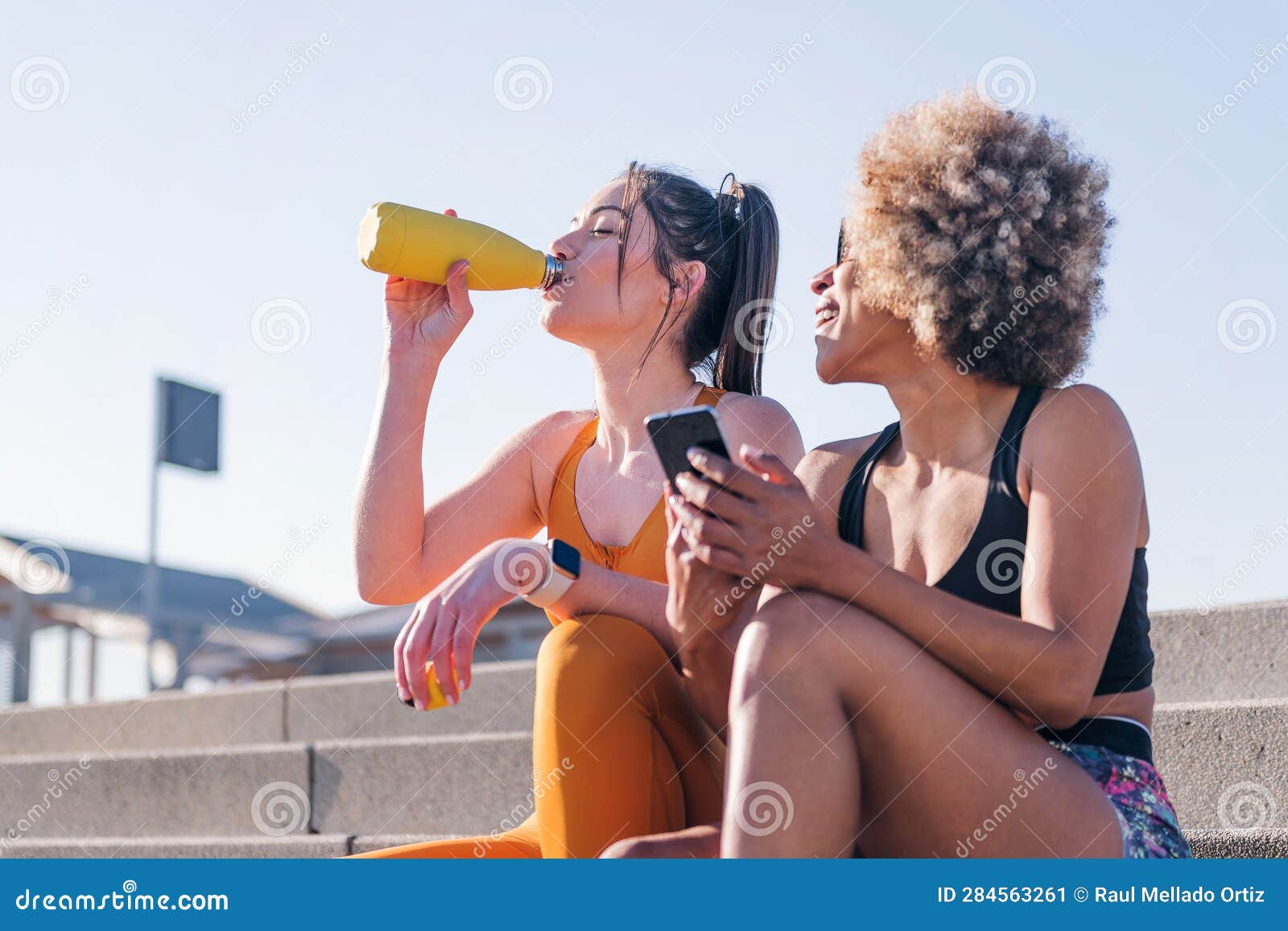 Two Runner Friends Drinking Water and Using Phone Stock Image - Image of connection, stairs ...