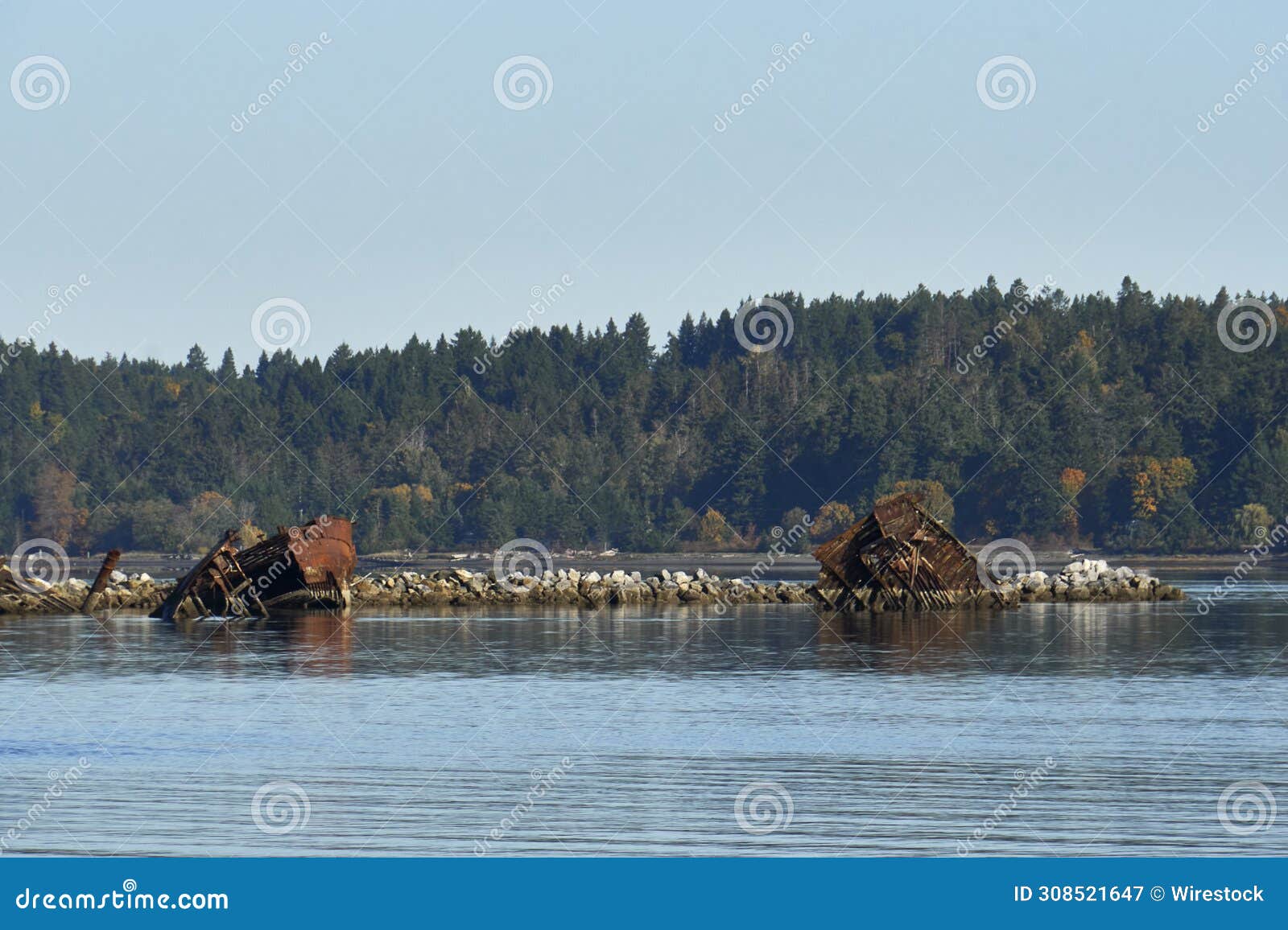 Two Rusty Derelict Navy Ship Hulls on an Ocean Breakwater that Formerly ...