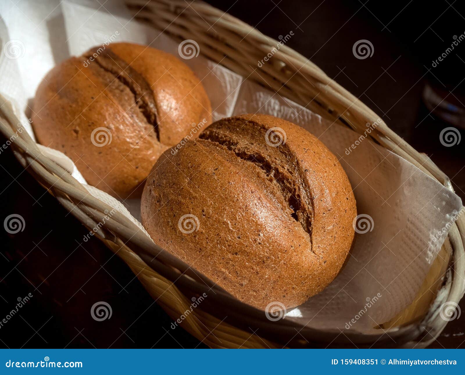 Two Rye Round Buns on a Napkin in a Straw Basket Stock Image - Image of ...