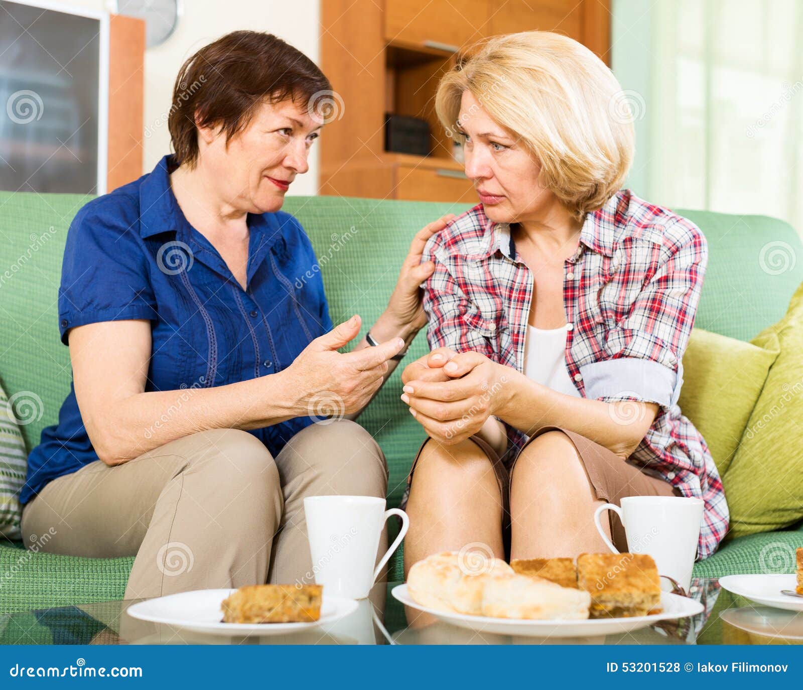 Two Sad Aged Women Talking On Couch Stock Photo - Image: 53201528