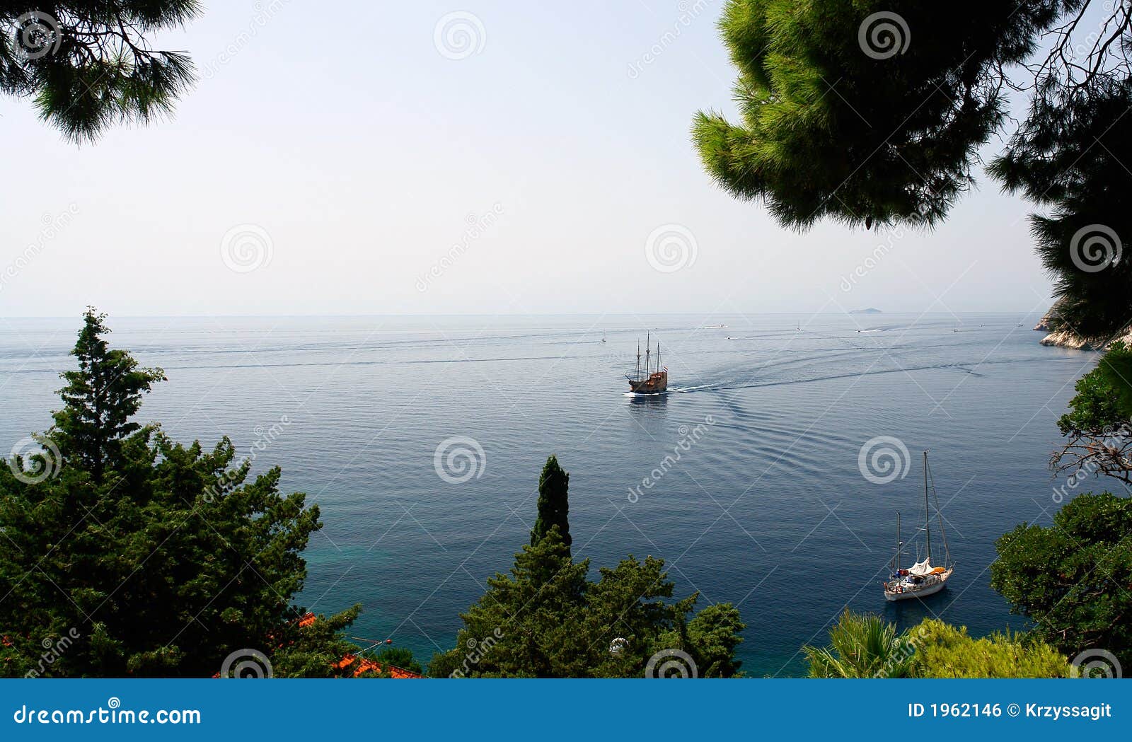 Two Sailing Boats Seen through Some Trees Stock Photo - Image of blue ...