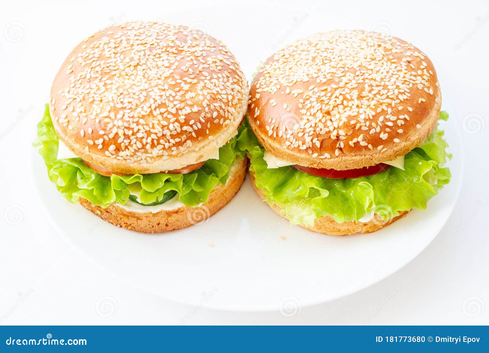 Two Sandwiches with Sesame Rolls on a White Plate. Home Made Burger ...