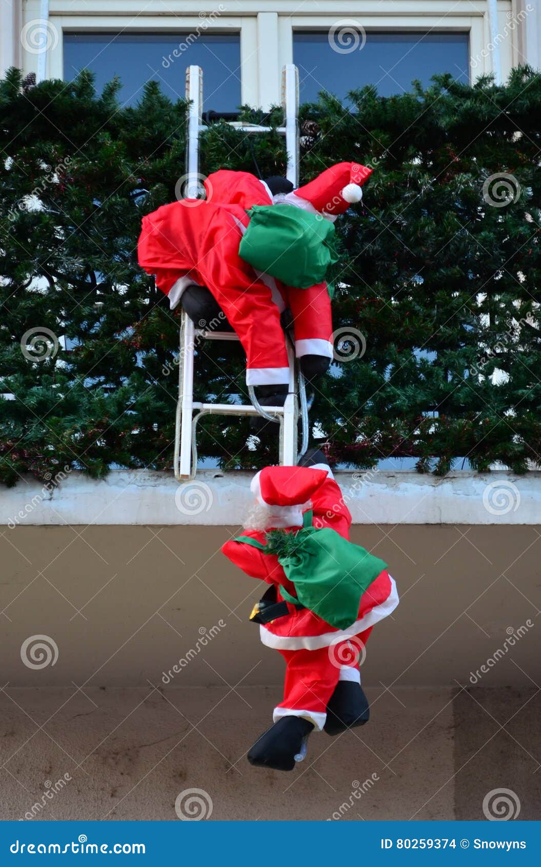 Two Santa Clauses Climb at Christmas Stock Photo - Image of gift, climb ...