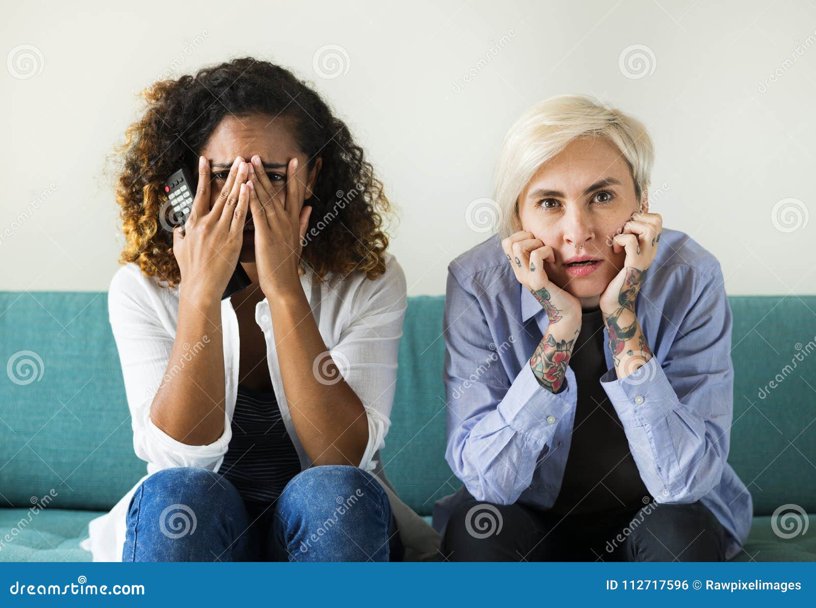 Two Scared Girls on the Couch Stock Photo - Image of frightened, focus ...
