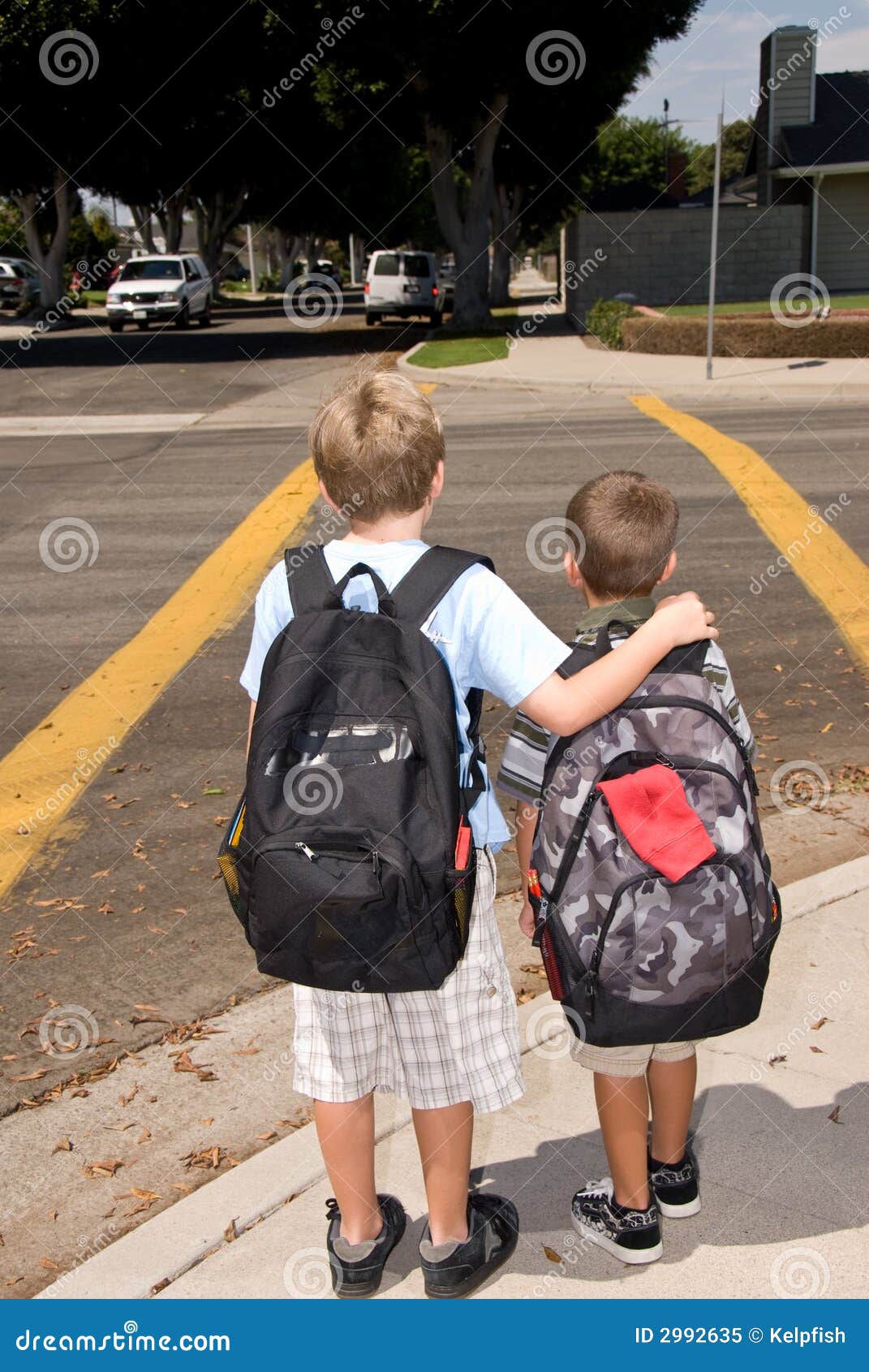 Two School Children Standing at Crosswalk Stock Image - Image of ...